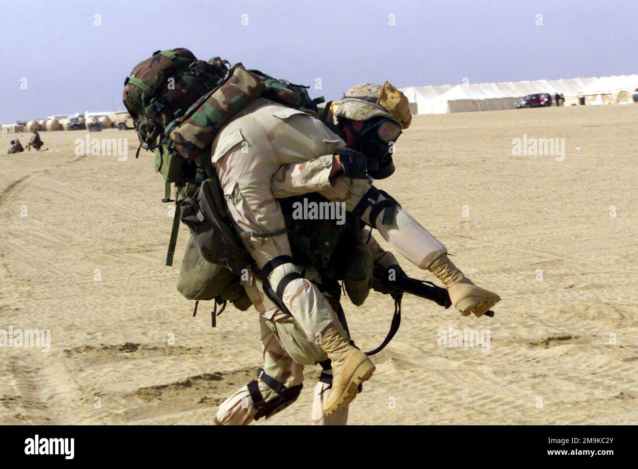 Wearing his M40A1 Chemical-Biological Mask, Corporal (CPL) Matthew ...