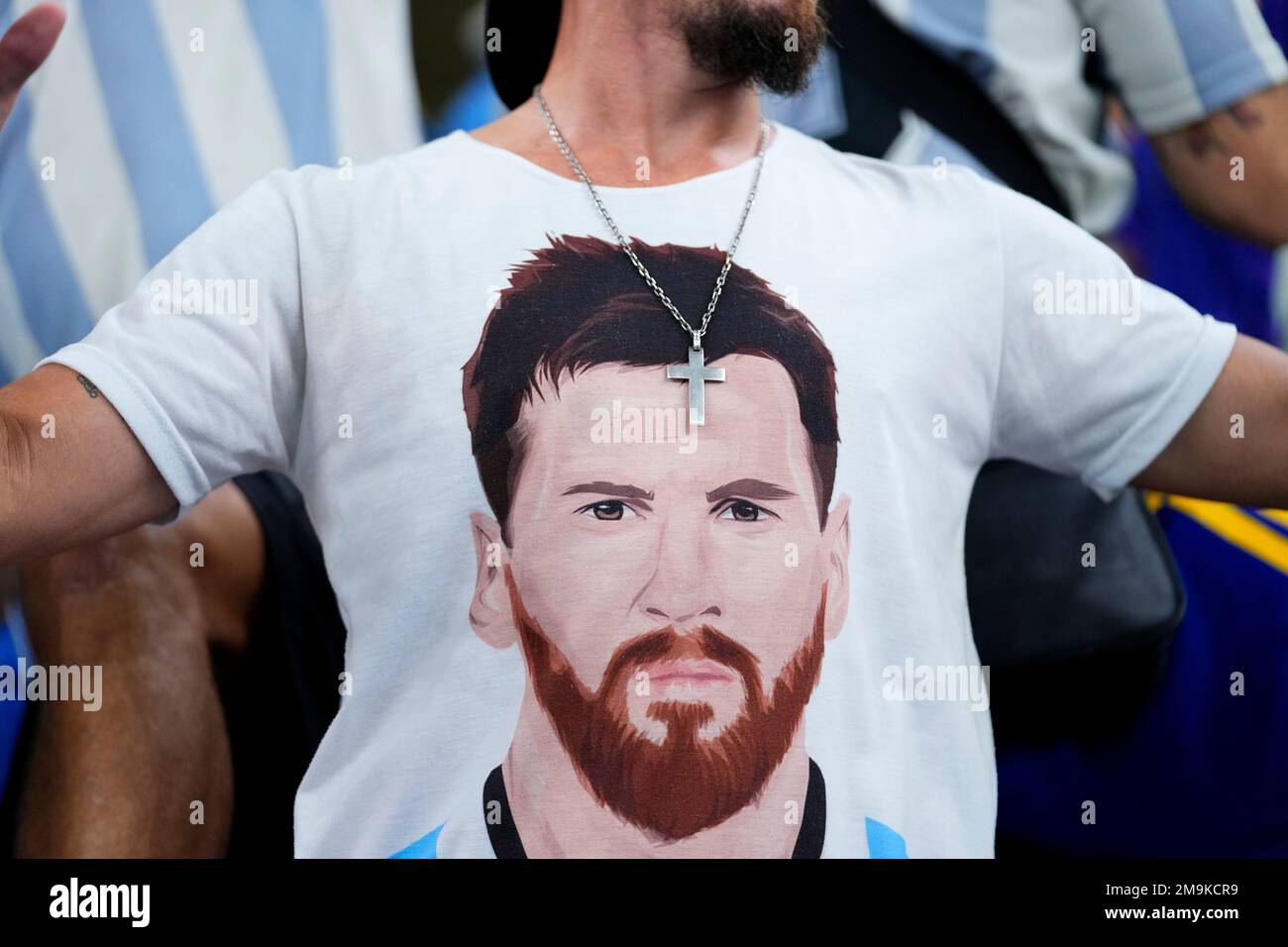 An soccer fan wears a T-shirt with Argentina's Lionel Messi image at ...