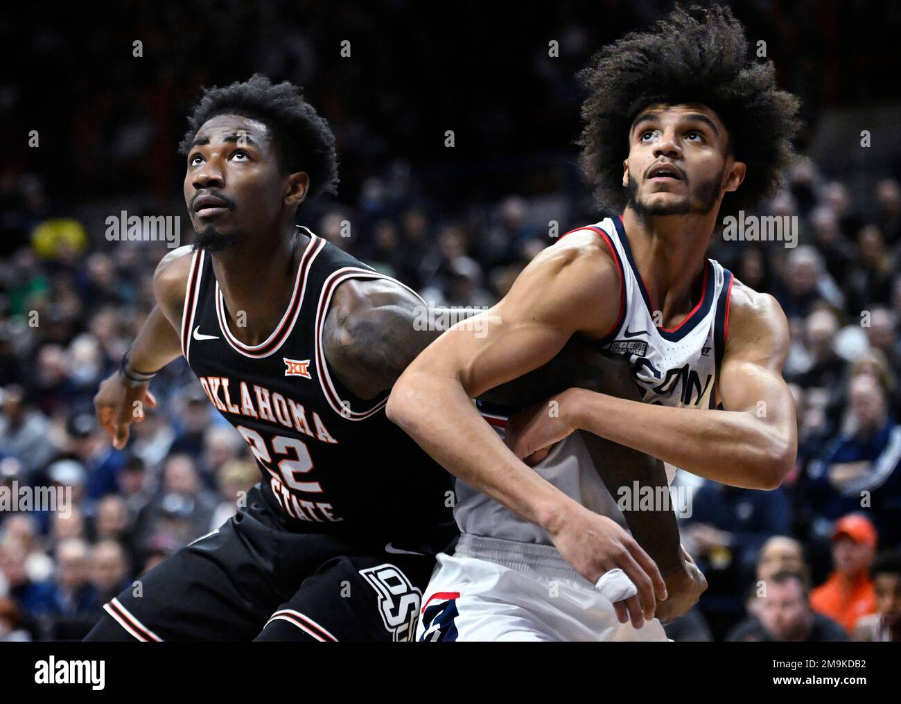 Oklahoma State's Kalib Boone (22) and Connecticut's Andre Jackson Jr ...