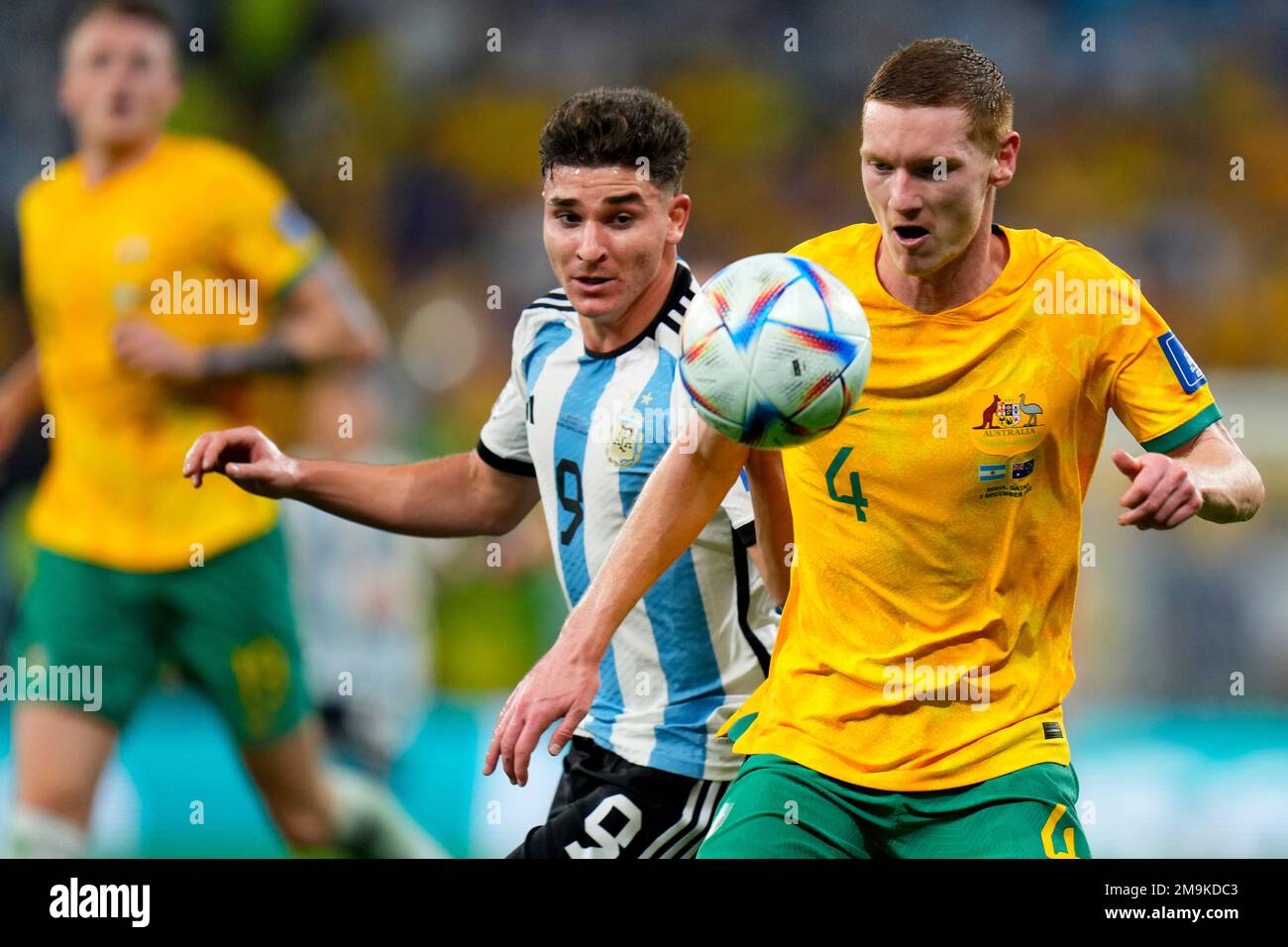 Argentina's Julian Alvarez, left, and Australia's Kye Rowles battle for ...