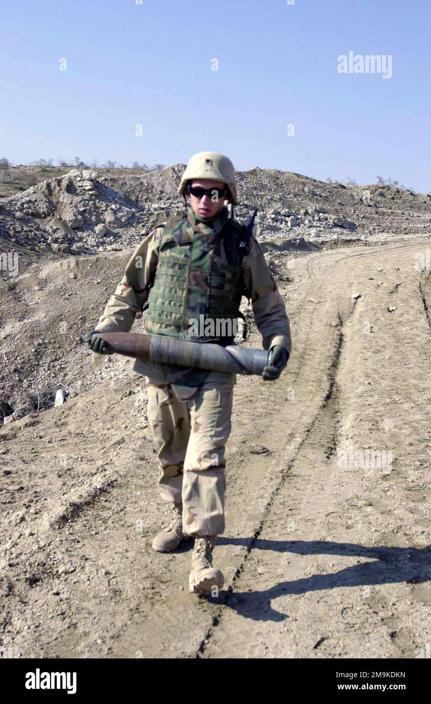 A soldier with the Explosive Ordnance Disposal (EOD) team from the ...