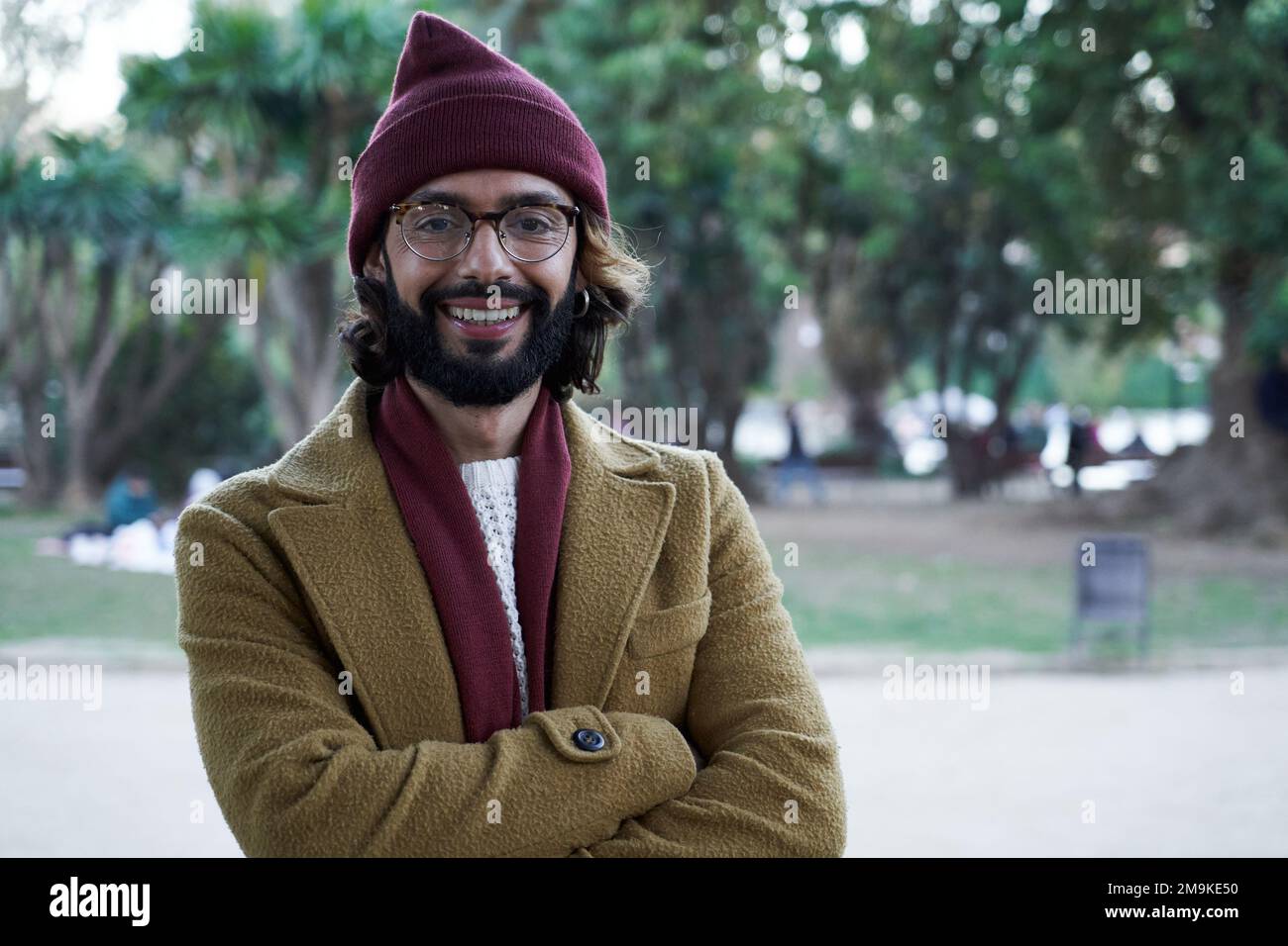 Portrait outdoors of handsome Italian man looking at camera with ...
