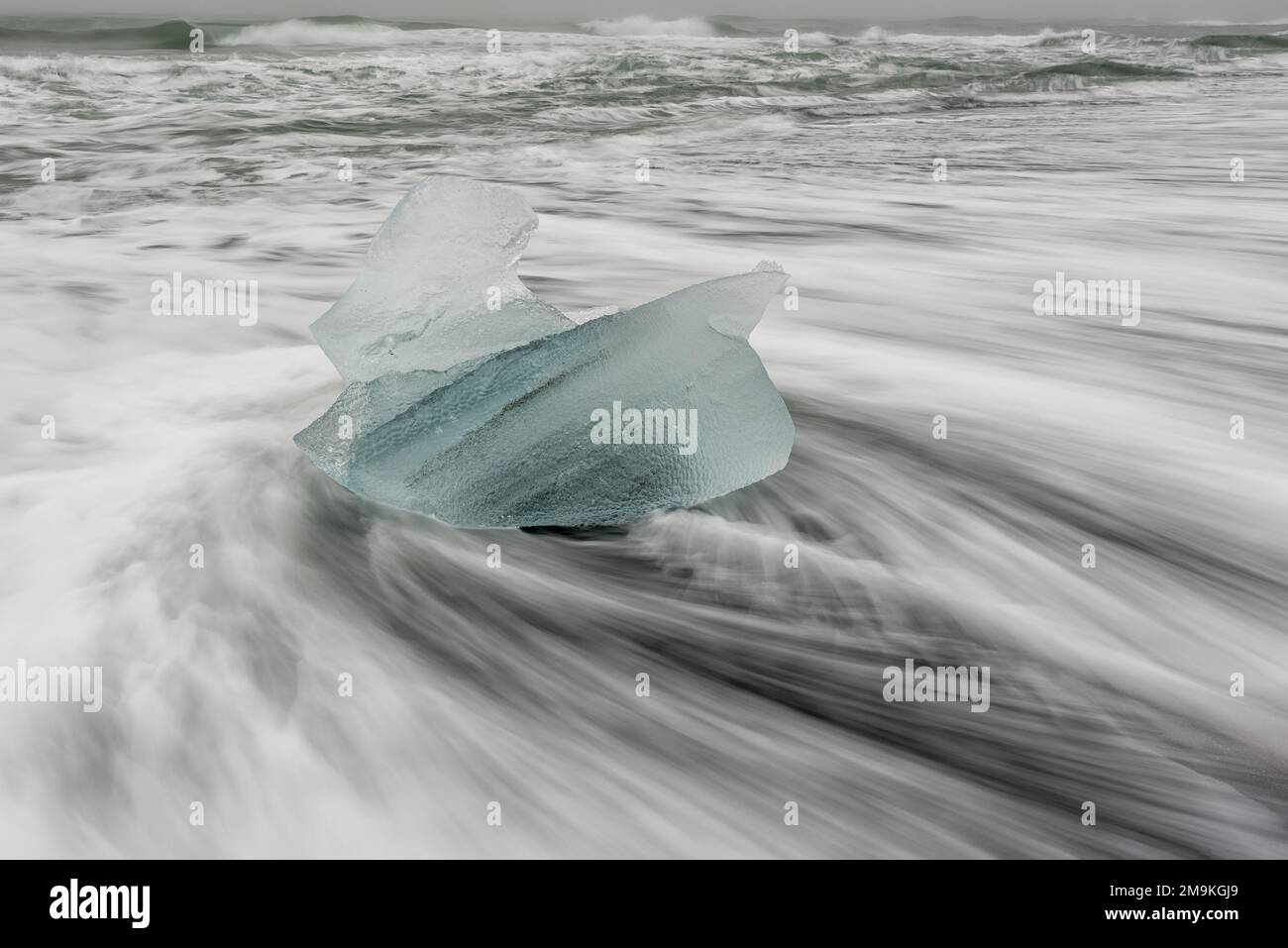 The amazing diamond beach in Iceland. Ice rock with black sand beach at ...