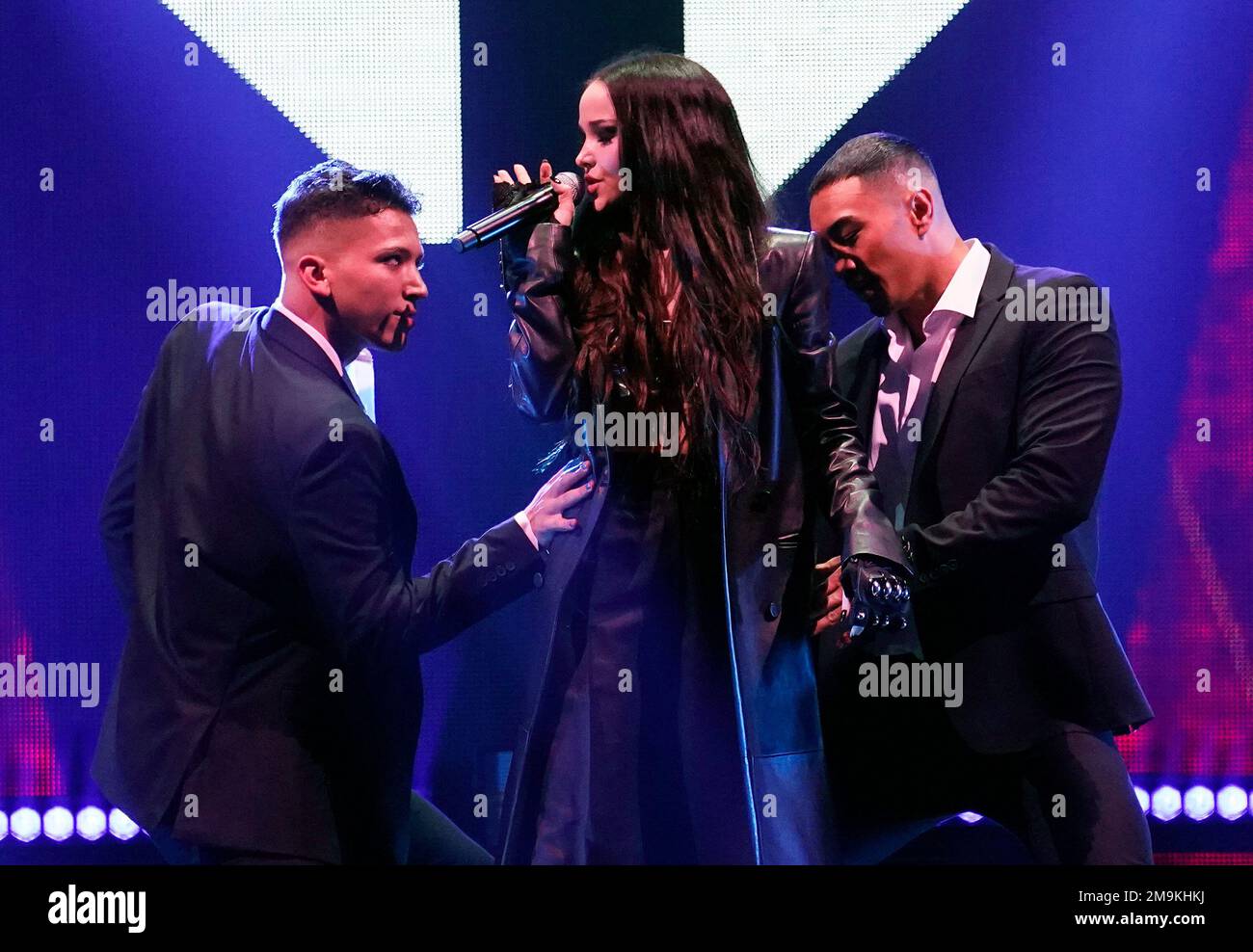 Dove Cameron, center, performs at the iHeartRadio Jingle Ball, Friday ...