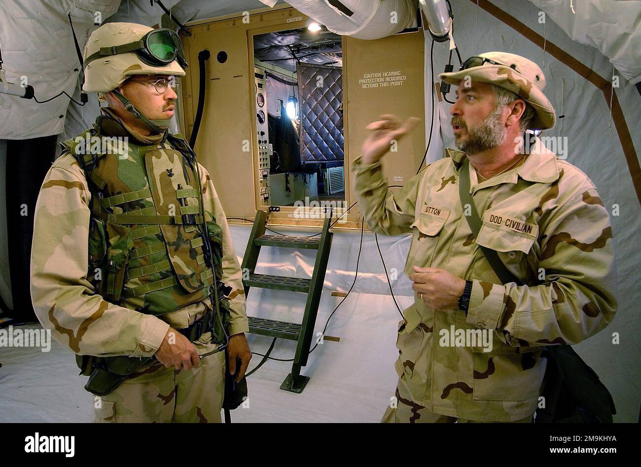 US Navy (USN) Hospital Corpsman Second Class (HM2) Thomas Miller (left ...