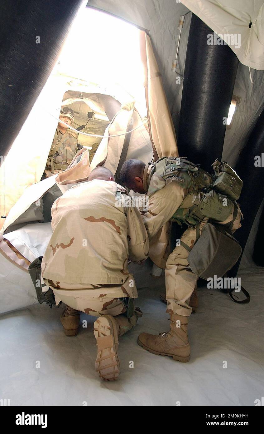 US Army (USA) Sergeant First Class (SFC) Dennis Rumple (left) and US ...