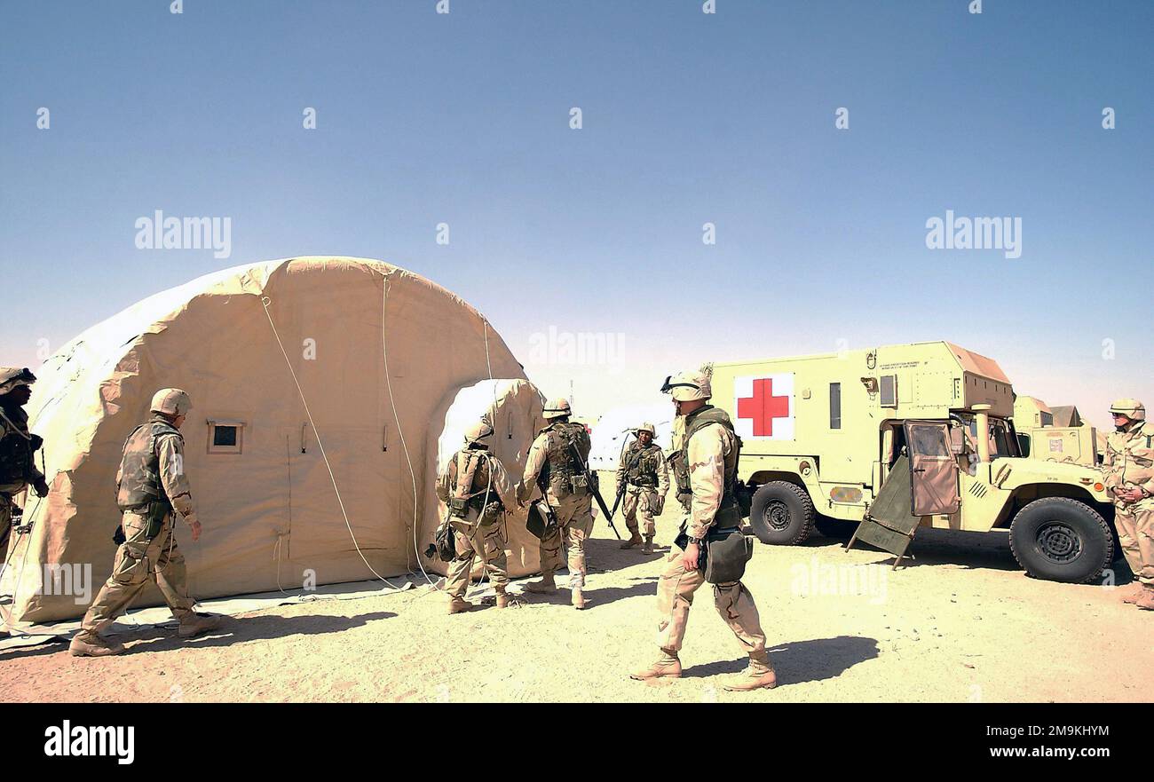 US Navy (USN) Corpsmen and US Marines Corps (USMC) Marines assigned to ...