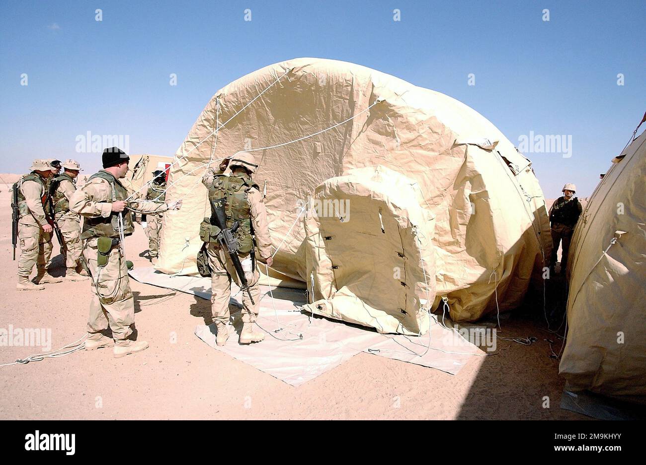 US Navy (USN) Corpsmen and US Marines Corps (USMC) Marines assigned to ...