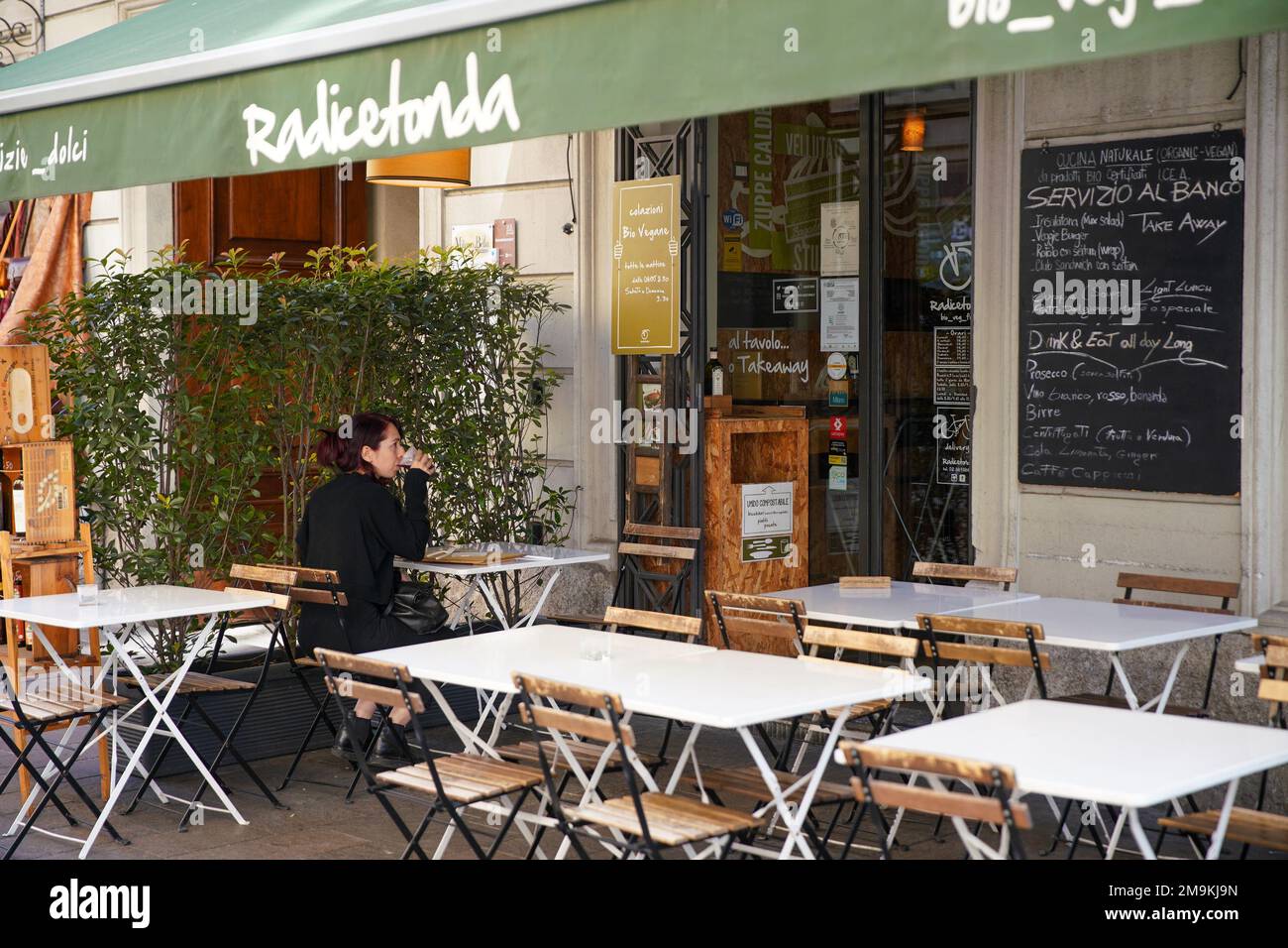 Drinking outside in a bar in the Milano city center Stock Photo - Alamy