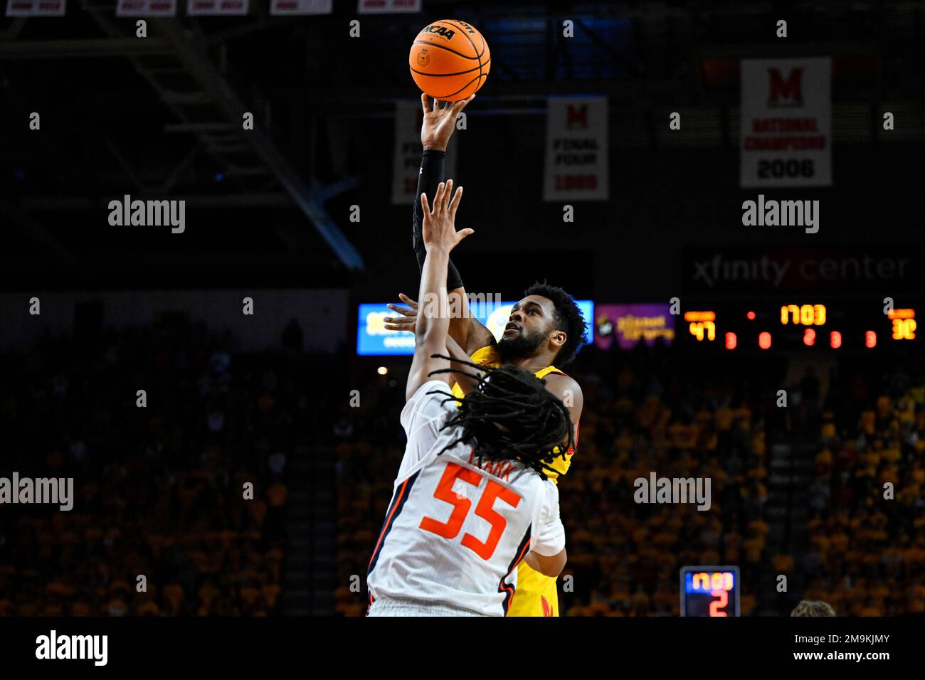 Maryland forward Donta Scott, top, shoots against Illinois guard Skyy ...