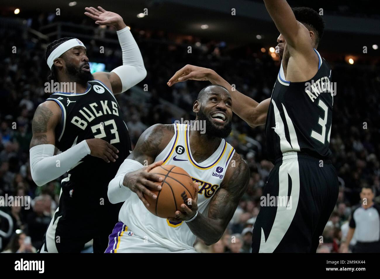 Los Angeles Lakers' LeBron James tries to drive between Milwaukee Bucks ...