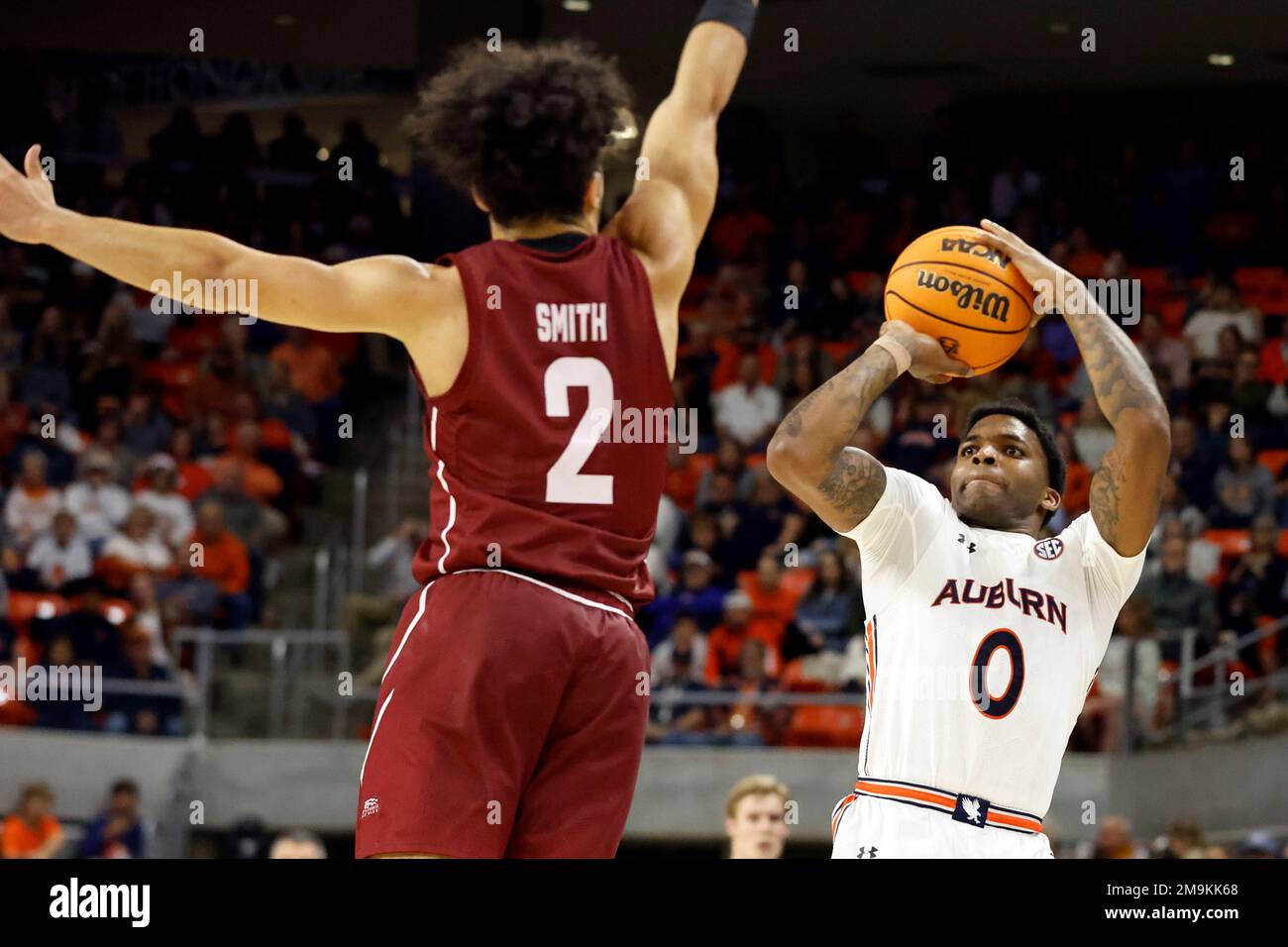 Auburn guard K.D. Johnson (0) shoots as Colgate guard Braeden Smith (2 ... Auburn guard K.D. Johnson (0) shoots as Colgate guard Braeden Smith (2 ...