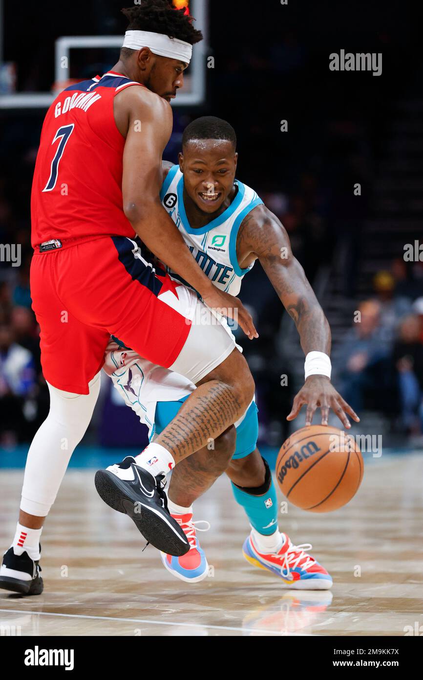 Charlotte Hornets guard Terry Rozier, right, collides with Washington ...