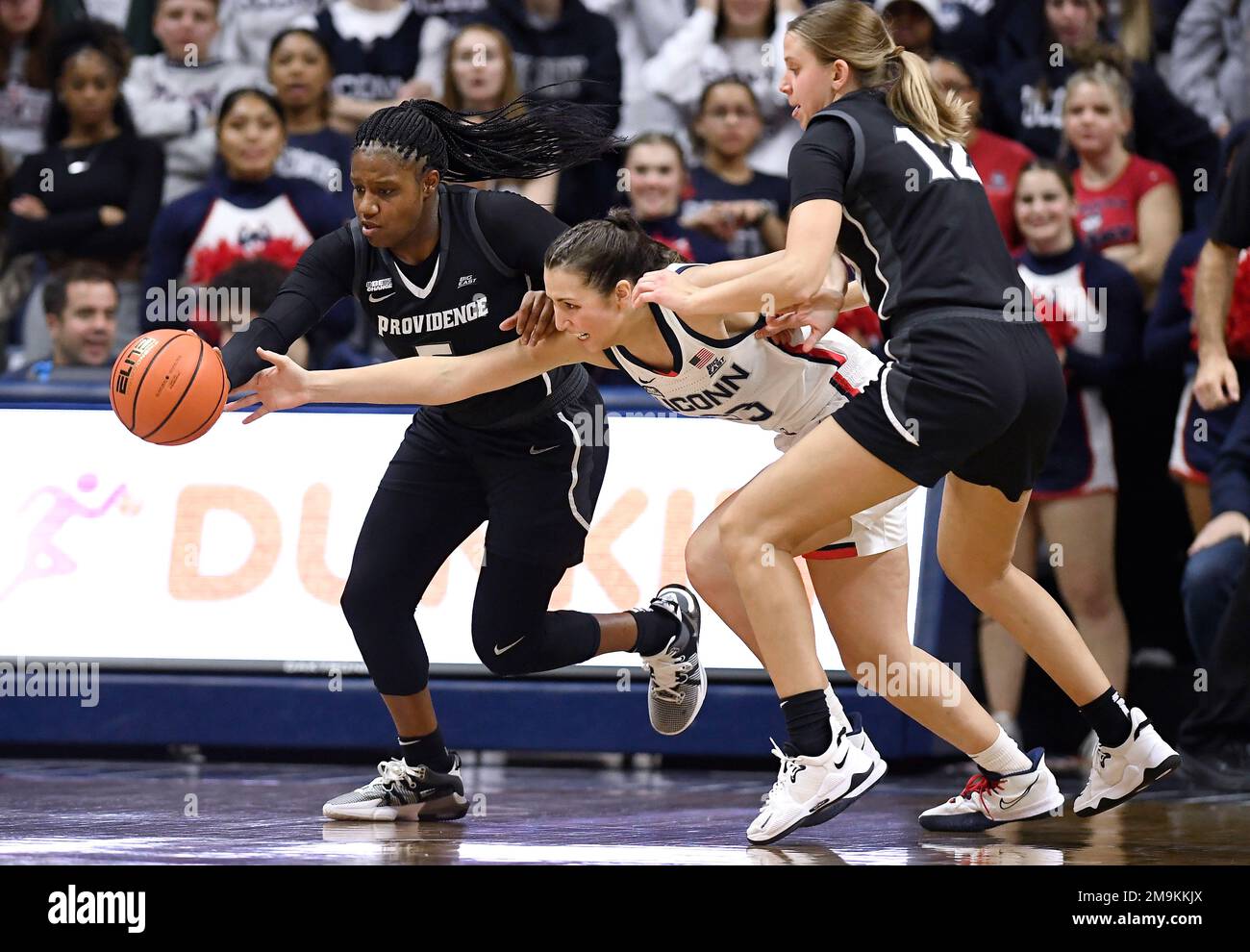 Providence's Janai Crooms, left, steals the ball from Connecticut's ...