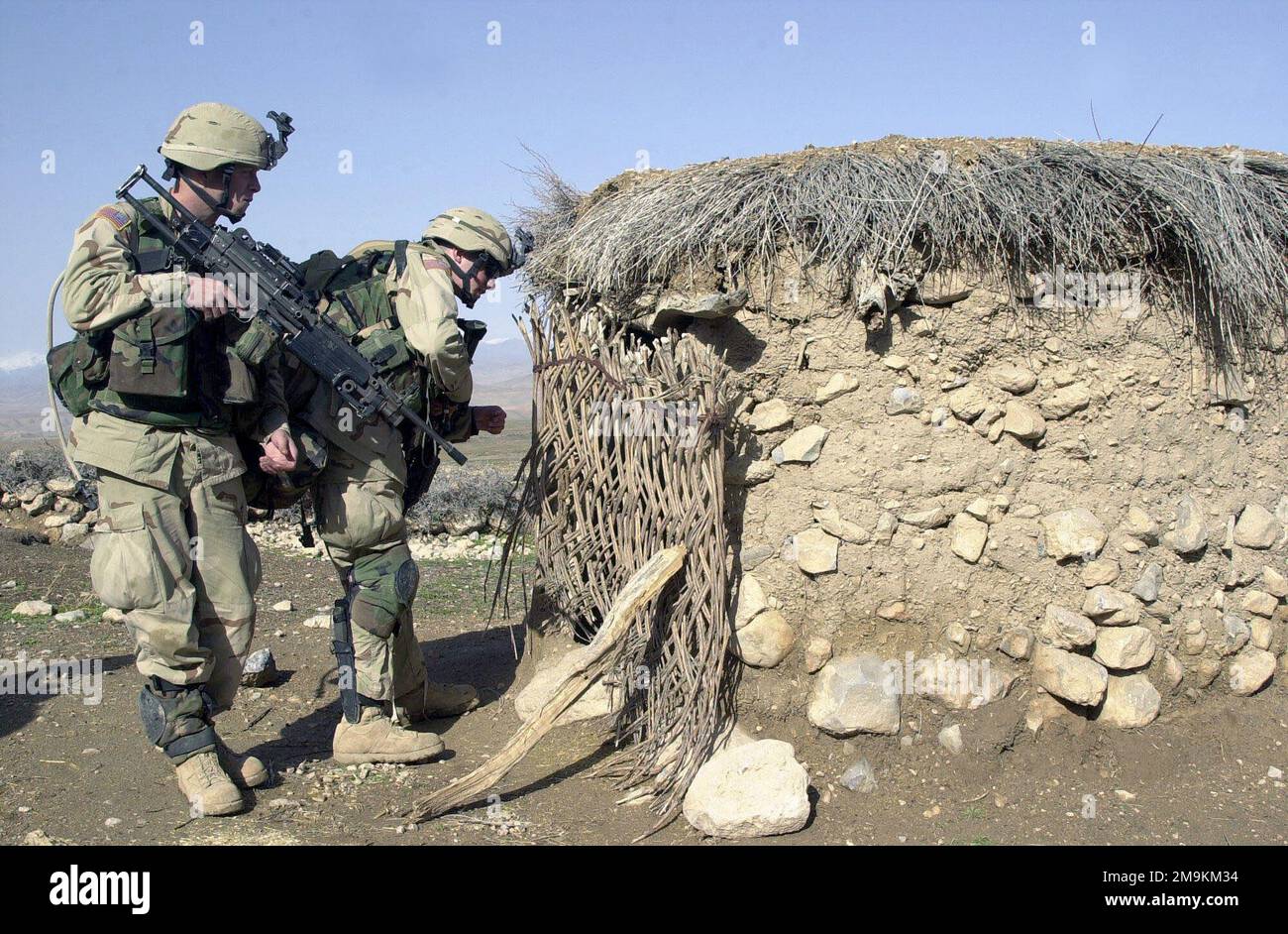 Armed with 5.56mm M4 Carbine rifles and FNMI 5.56 mm M249 Squad ...