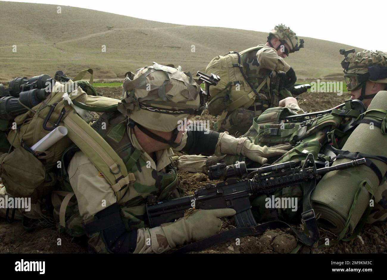 Armed with 5.56mm M4 Carbine rifles and FNMI 5.56 mm M249 Squad ...