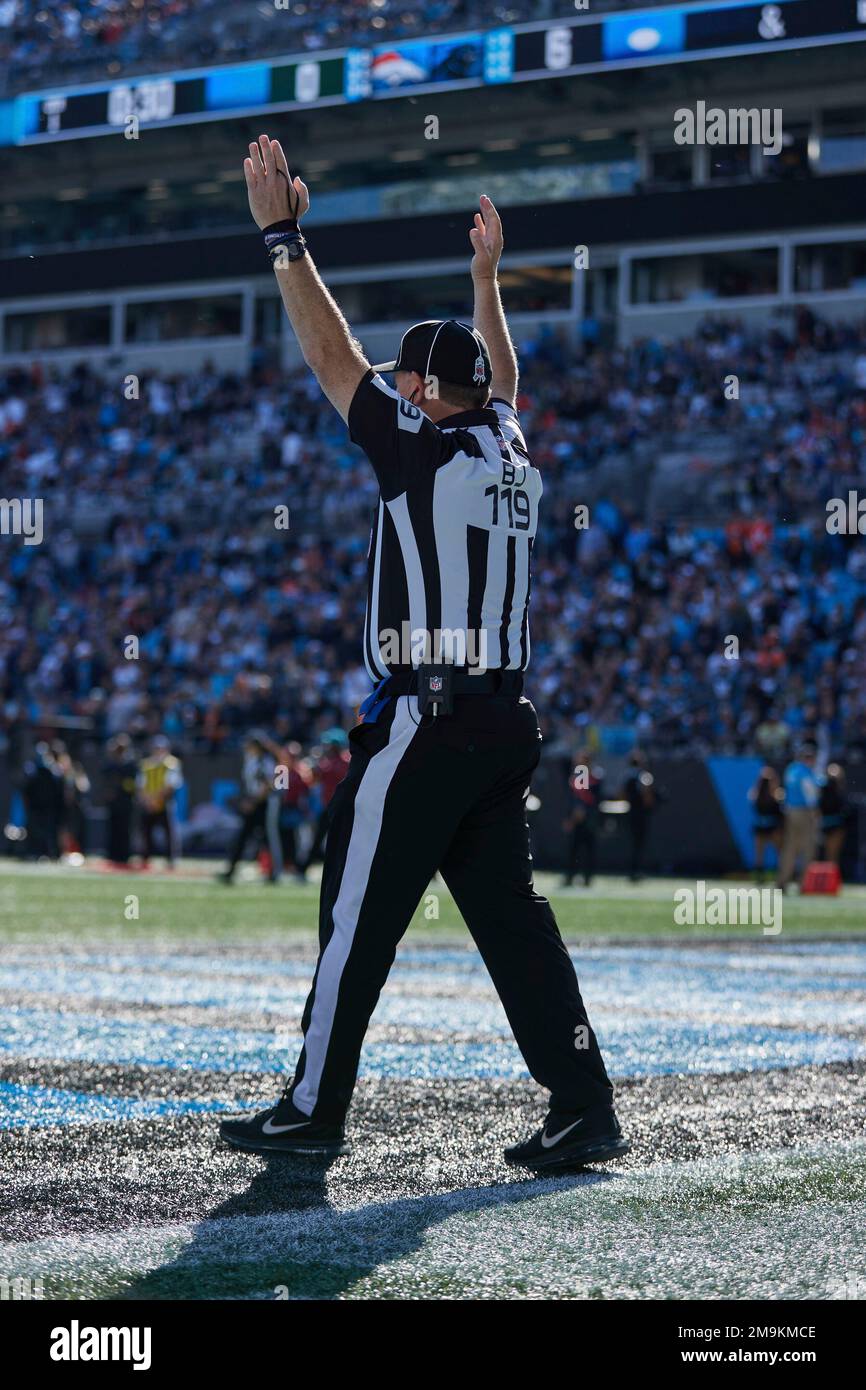 Back judge Greg Wilson (119) at work during an NFL football game ...