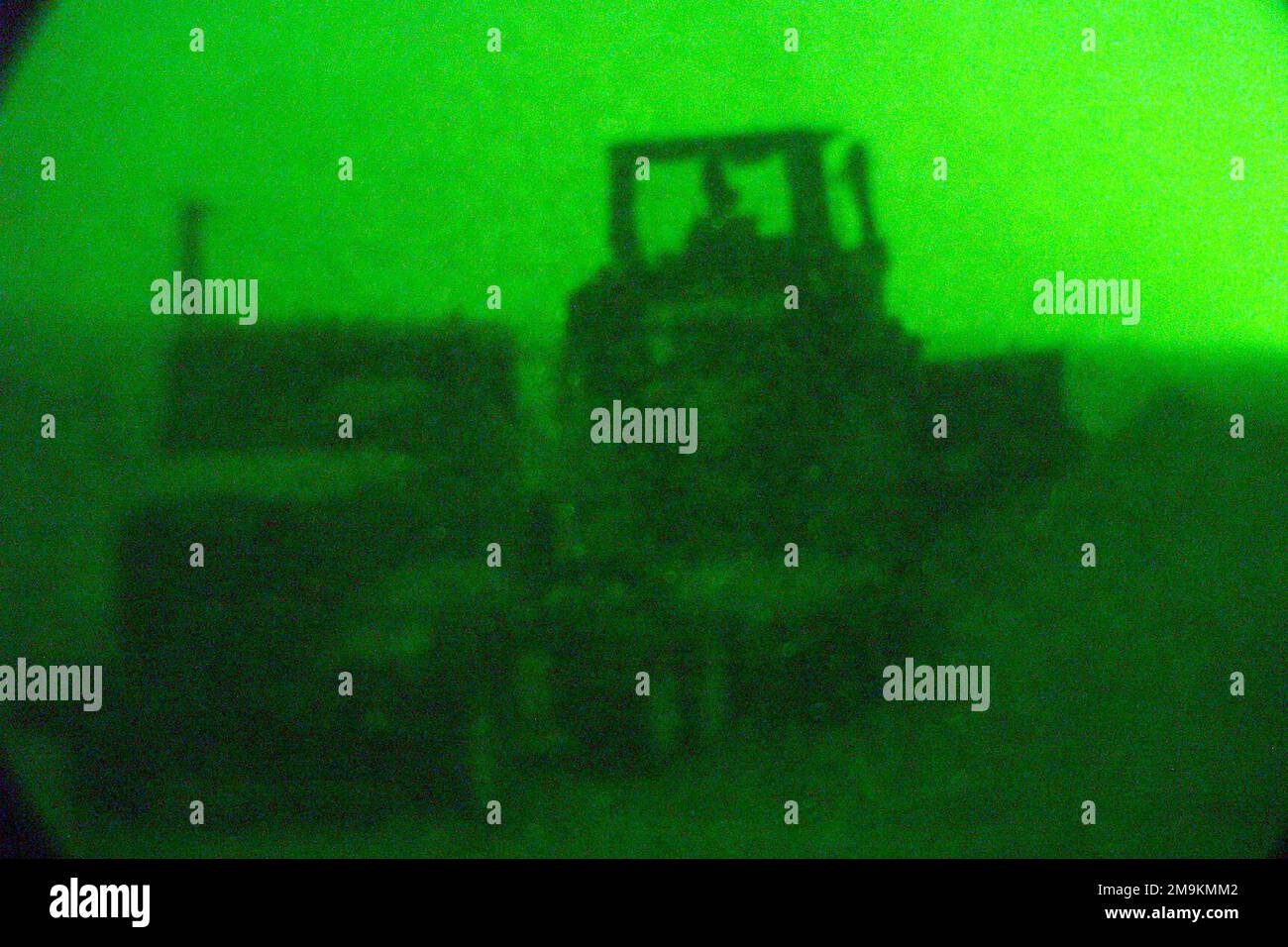 An earthmoving Caterpillar bulldozer is delivered by a US Navy (USN ...