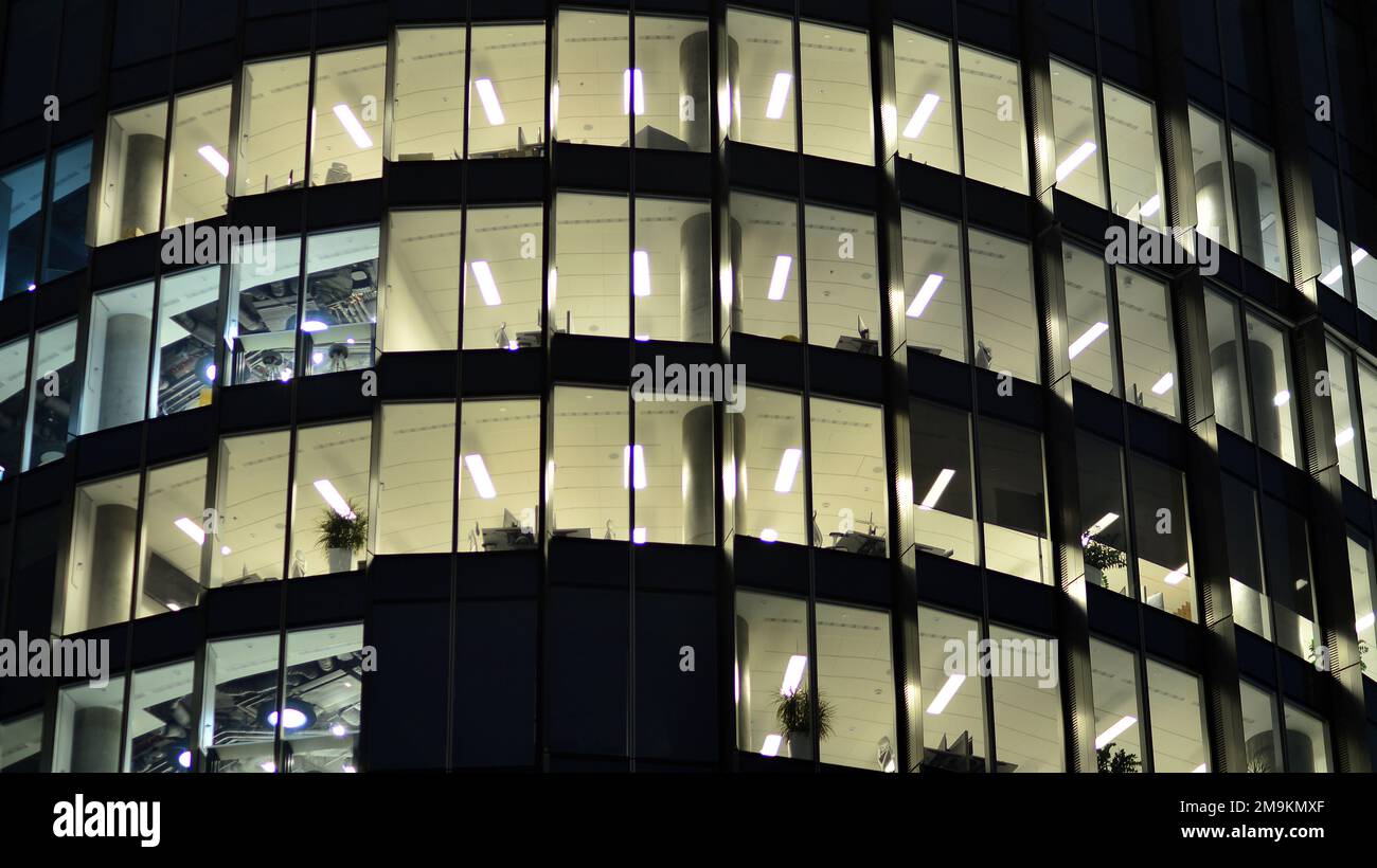 Modern office building in city at the night. View on illuminated ...