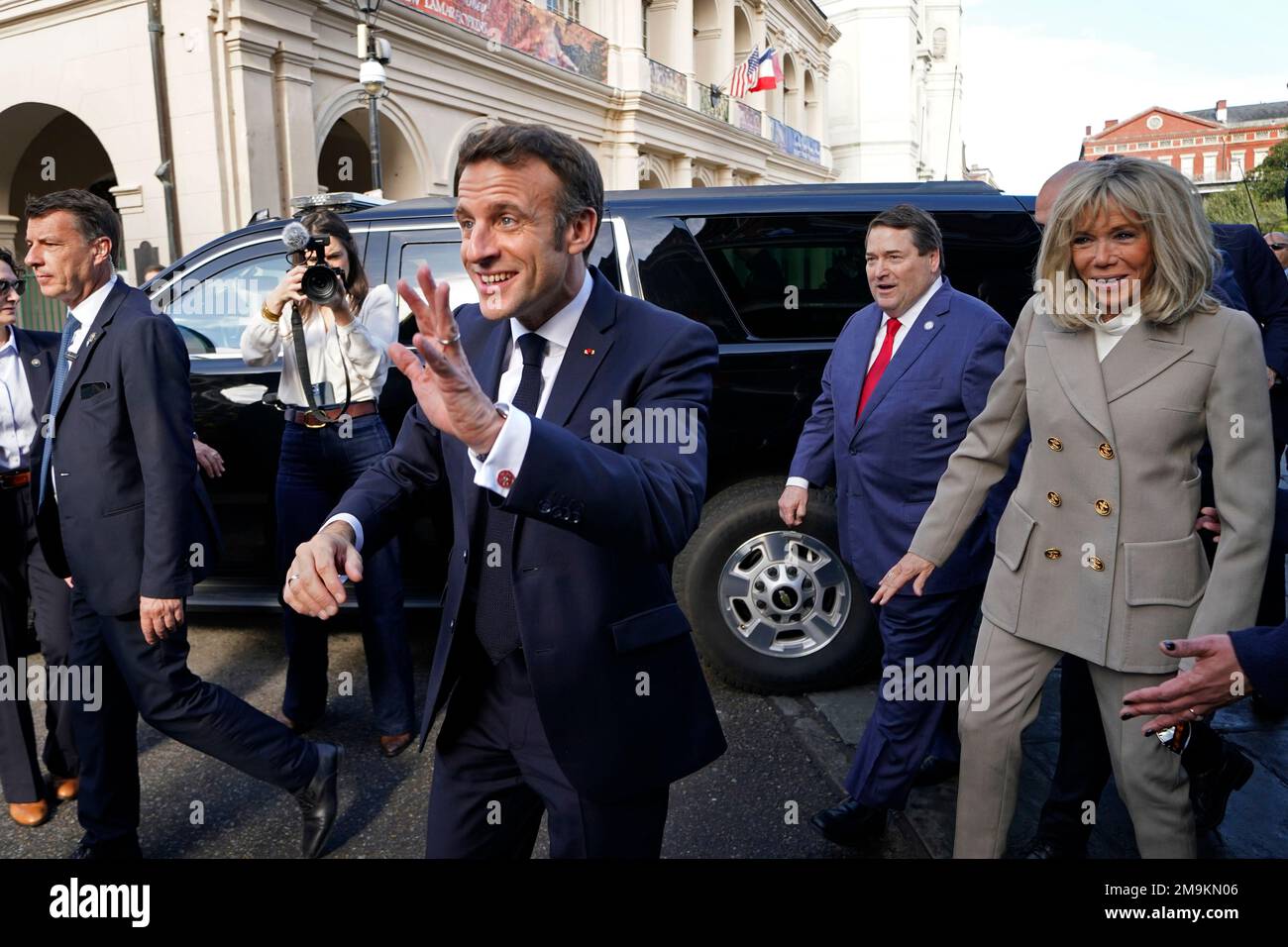 French President Emmanuel Macron and his wife, Brigitte Macron, greet ...