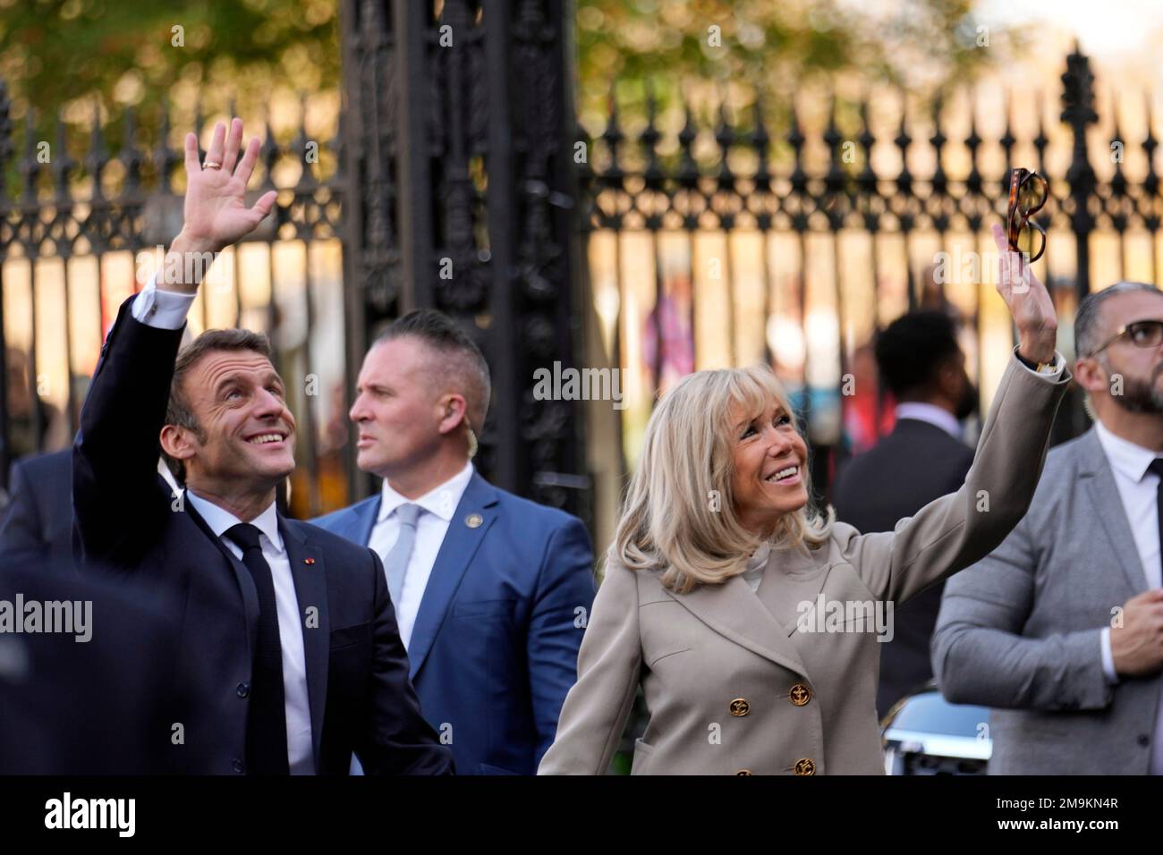 French President Emmanuel Macron and his wife Brigitte Macron waves to ...