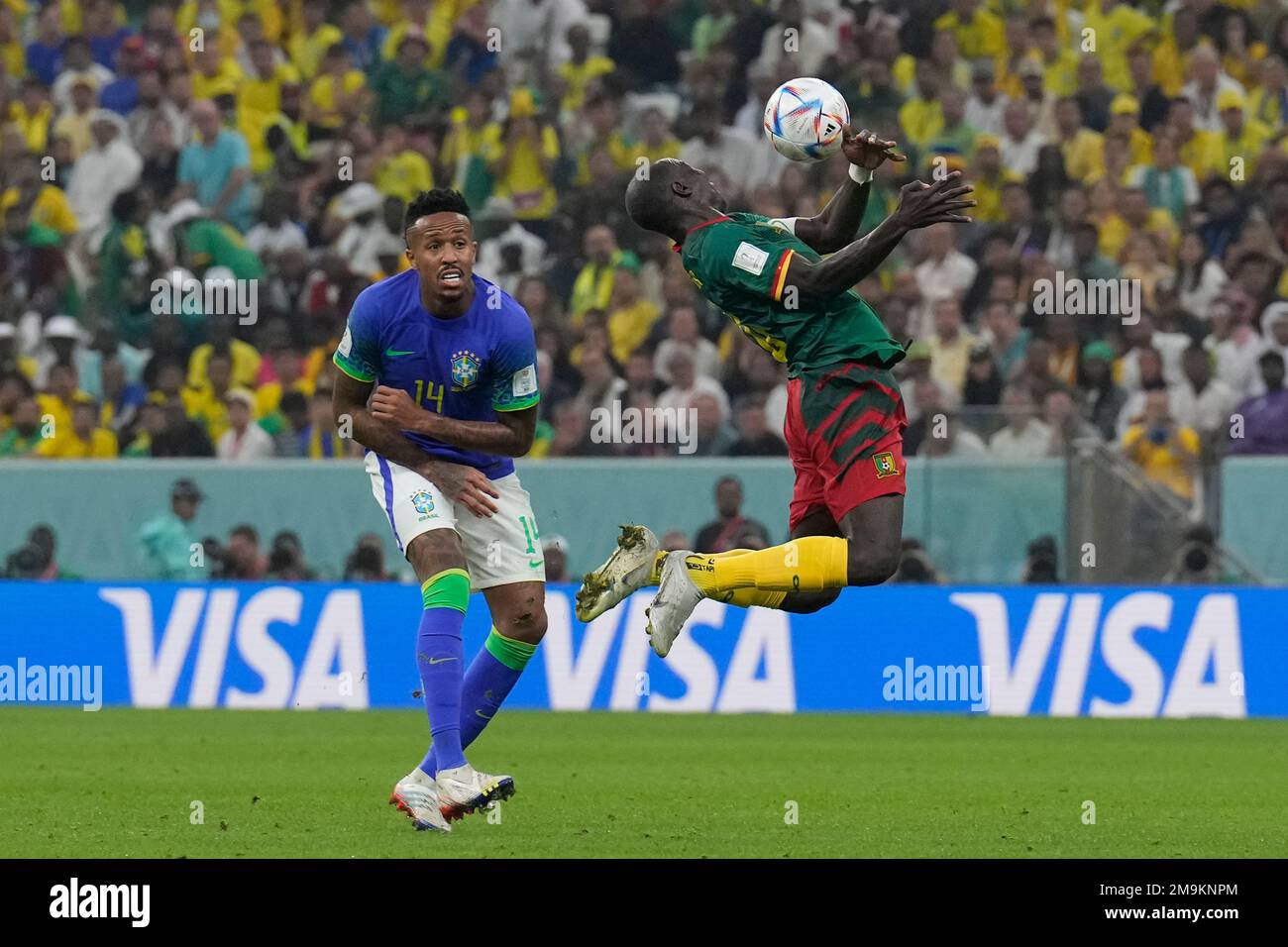 Cameroon's Vincent Aboubakar, right, controls the ball past Brazil's ...