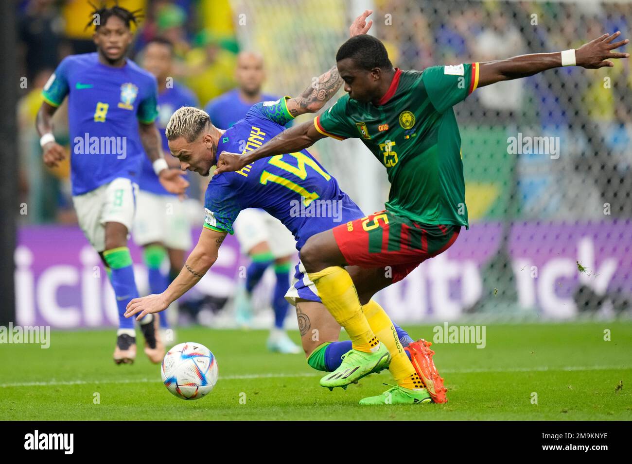 Cameroon's Tolo Nouhou, right, and Brazil's Antony, left, fight for the ...