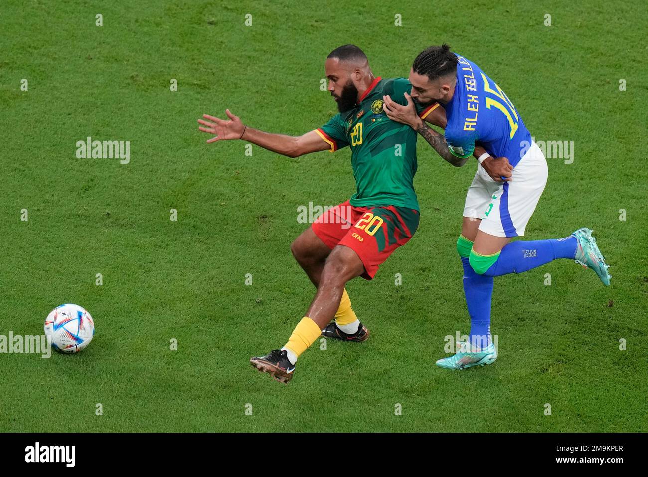 Cameroon's Bryan Mbeumo, left, is challenged by Brazil's Alex Telles ...