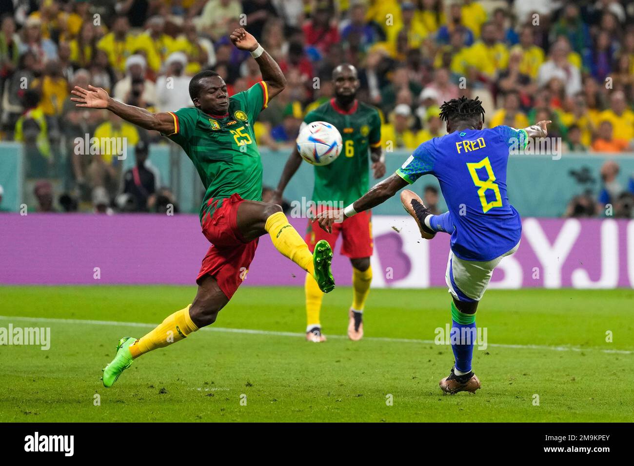 Brazil's Fred, right vies for the ball with Cameroon's Tolo Nouhou ...