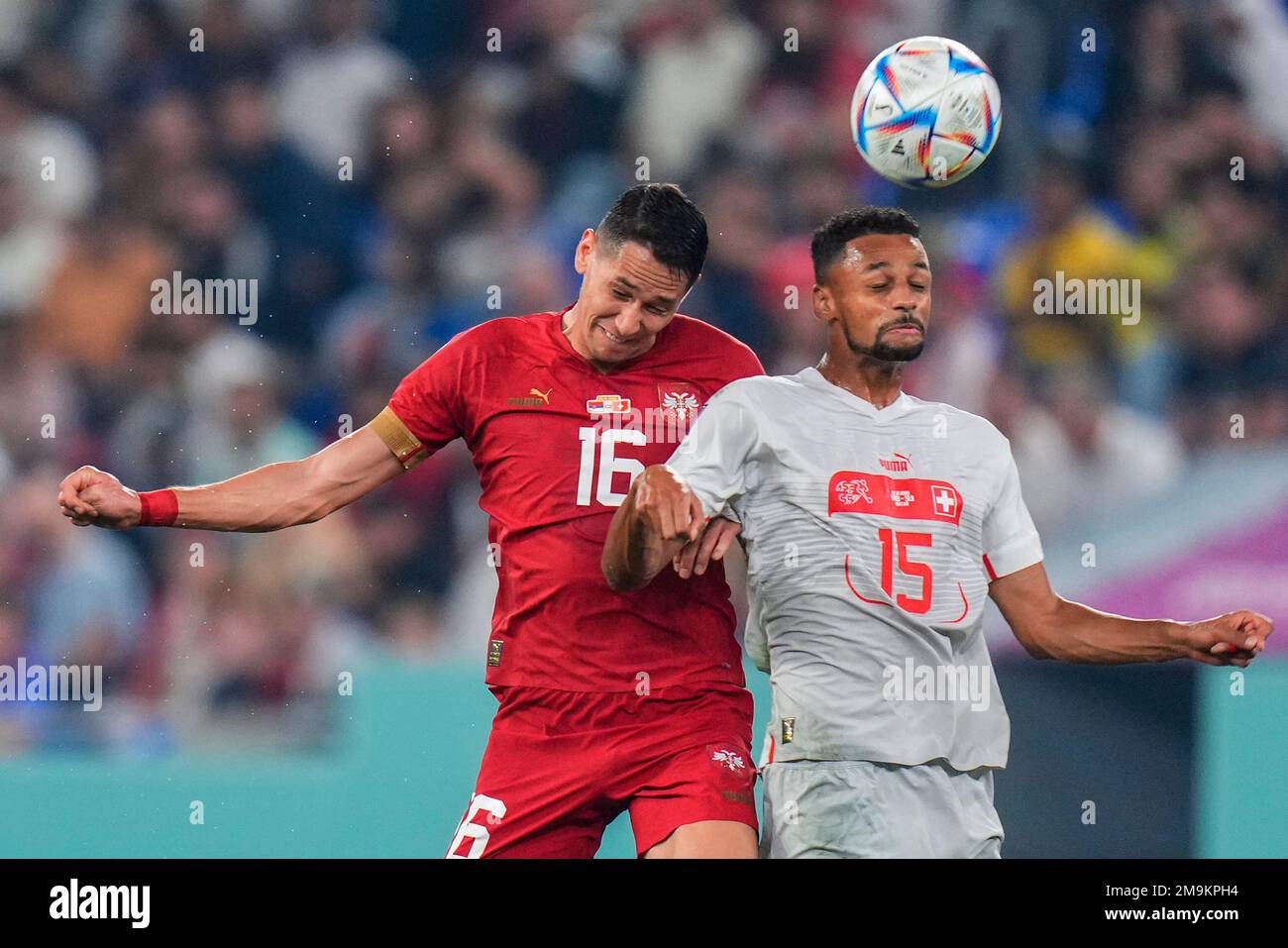 Serbia's Sasa Lukic, left, heads for the ball with Switzerland's ...