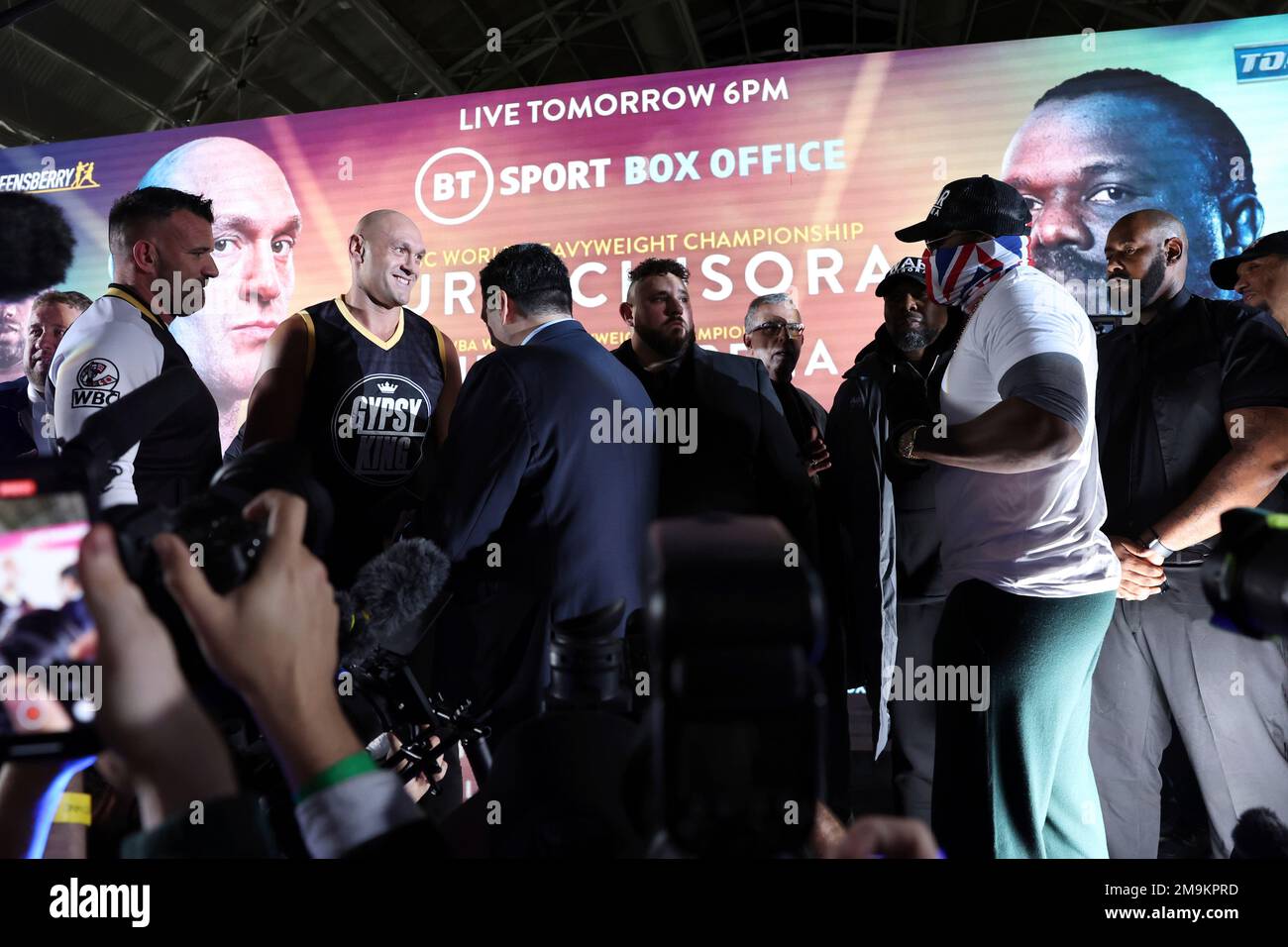 Boxer Tyson Fury the WBC heavyweight champion, left, smiles as he looks ...