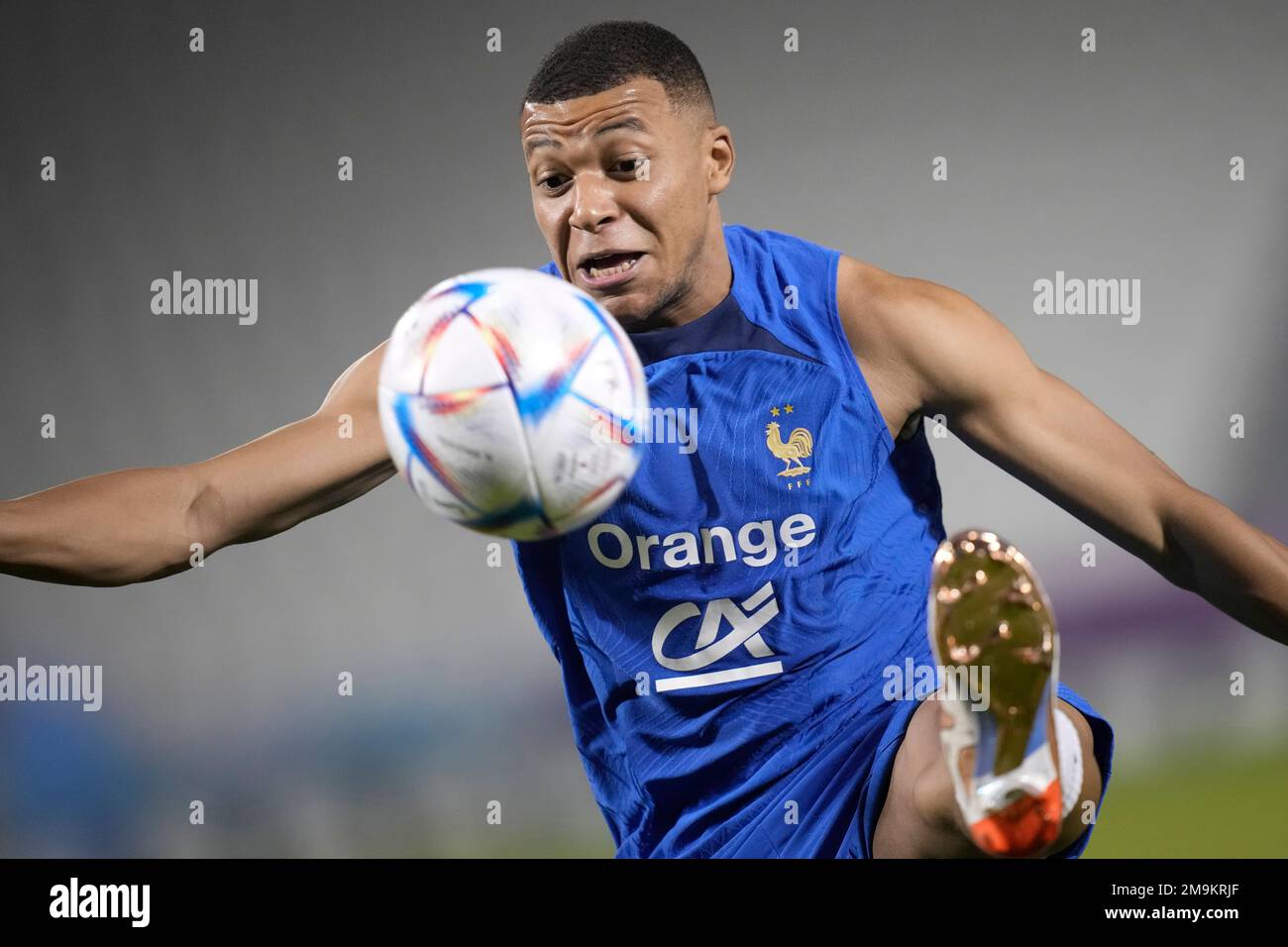 France's Kylian Mbappe controls the ball during a training session at ...