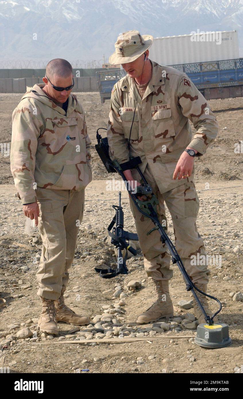 Larry D. Perry, left, a civilian contractor with the CY TERRA Corp out ...