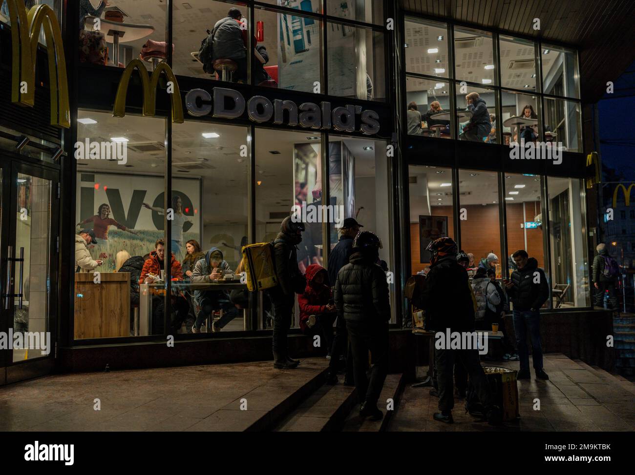 People eat in a fast food restaurant in Kyiv, Ukraine, Friday, Dec. 2 ...