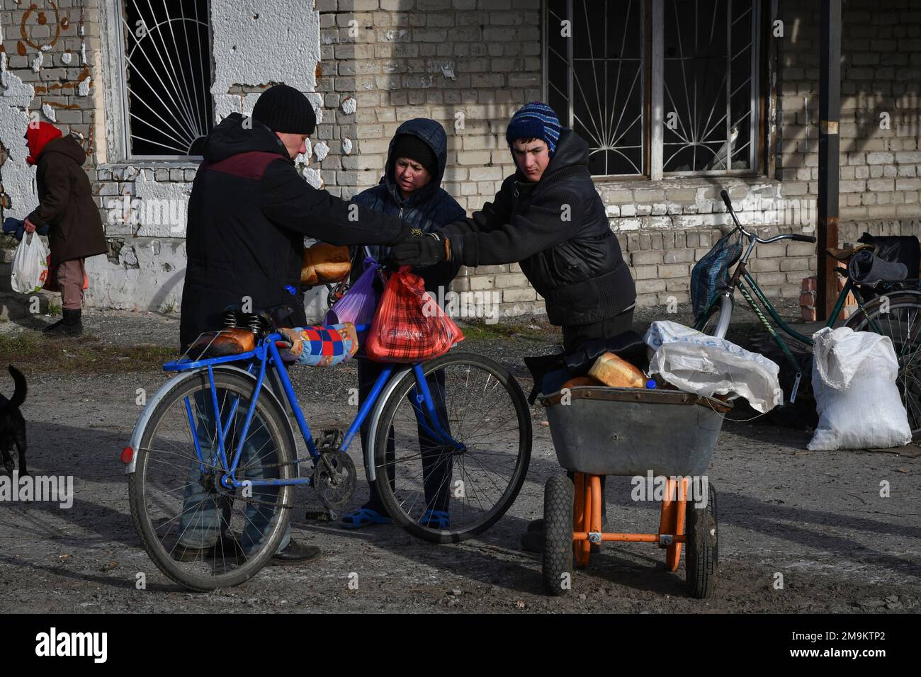 Local resident receive a food at a mobile humanitarian aid point in the ...