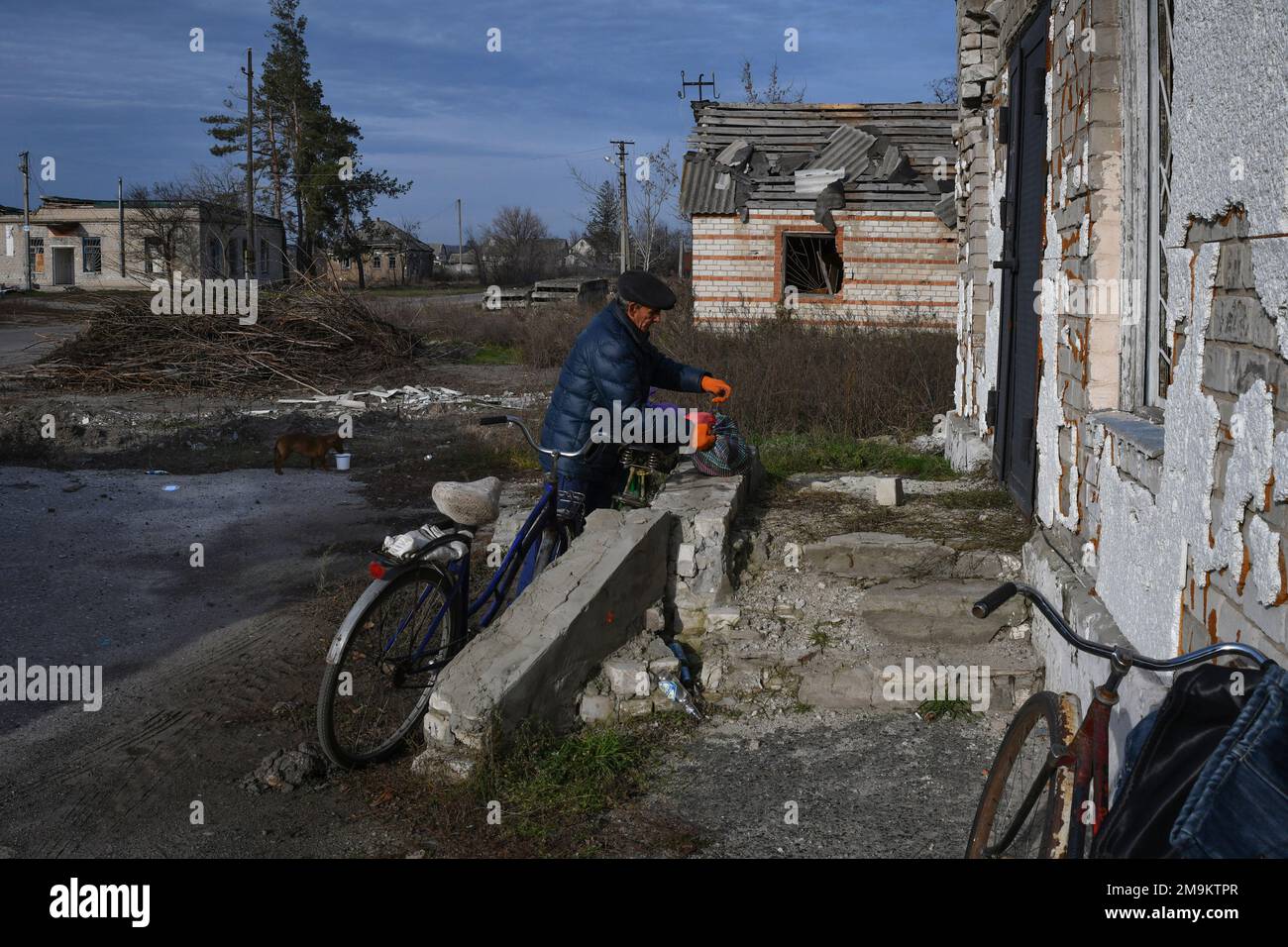 A local resident receives a food at a mobile humanitarian aid point in ...