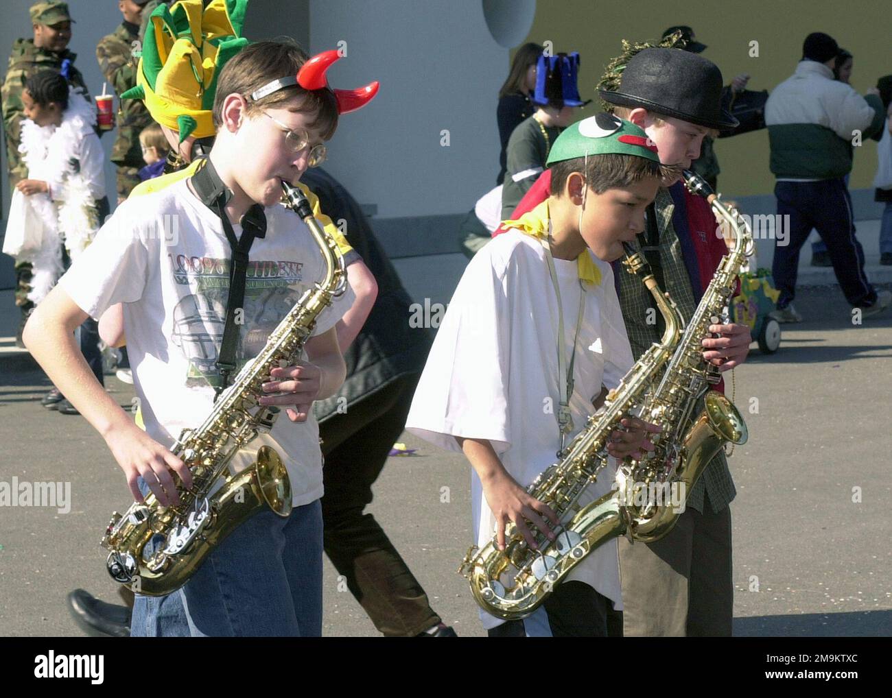 A trio of saxophonists from the Aviano Elementary School play their ...