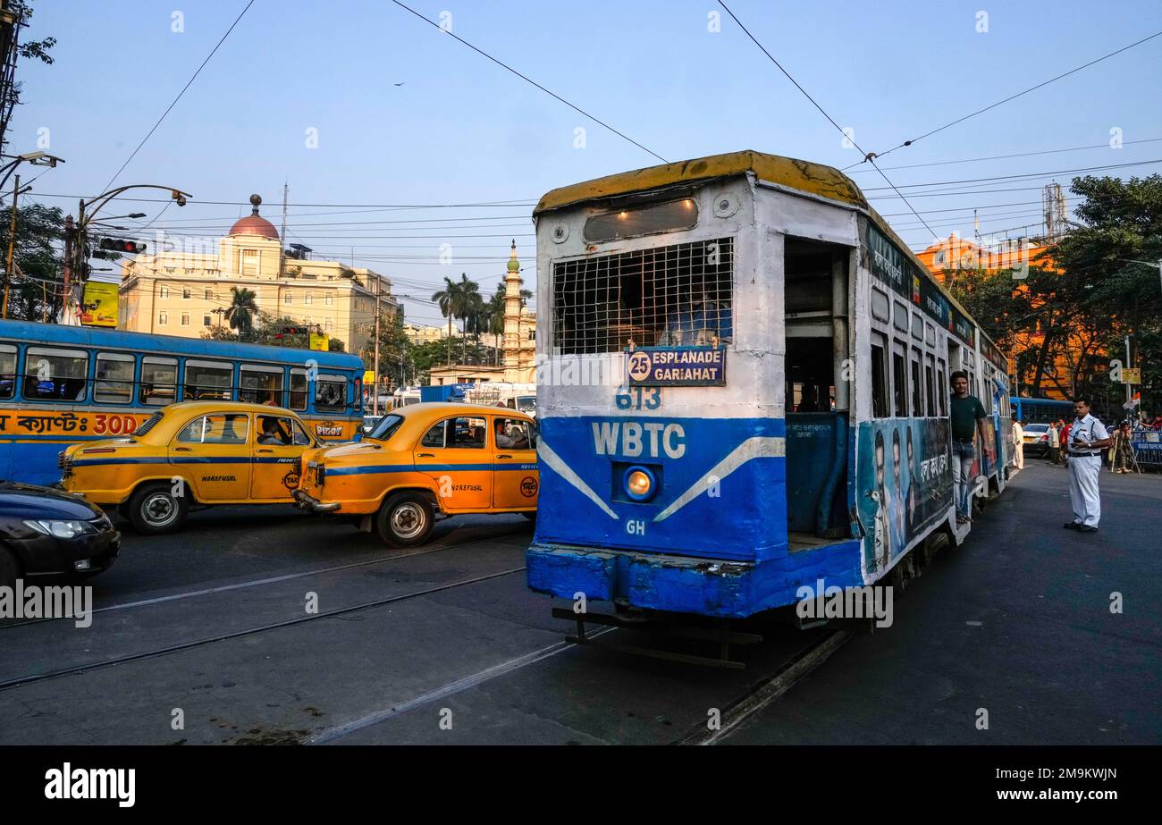 A tram car drives past a busy crossing in Kolkata, India, Friday, Dec ...