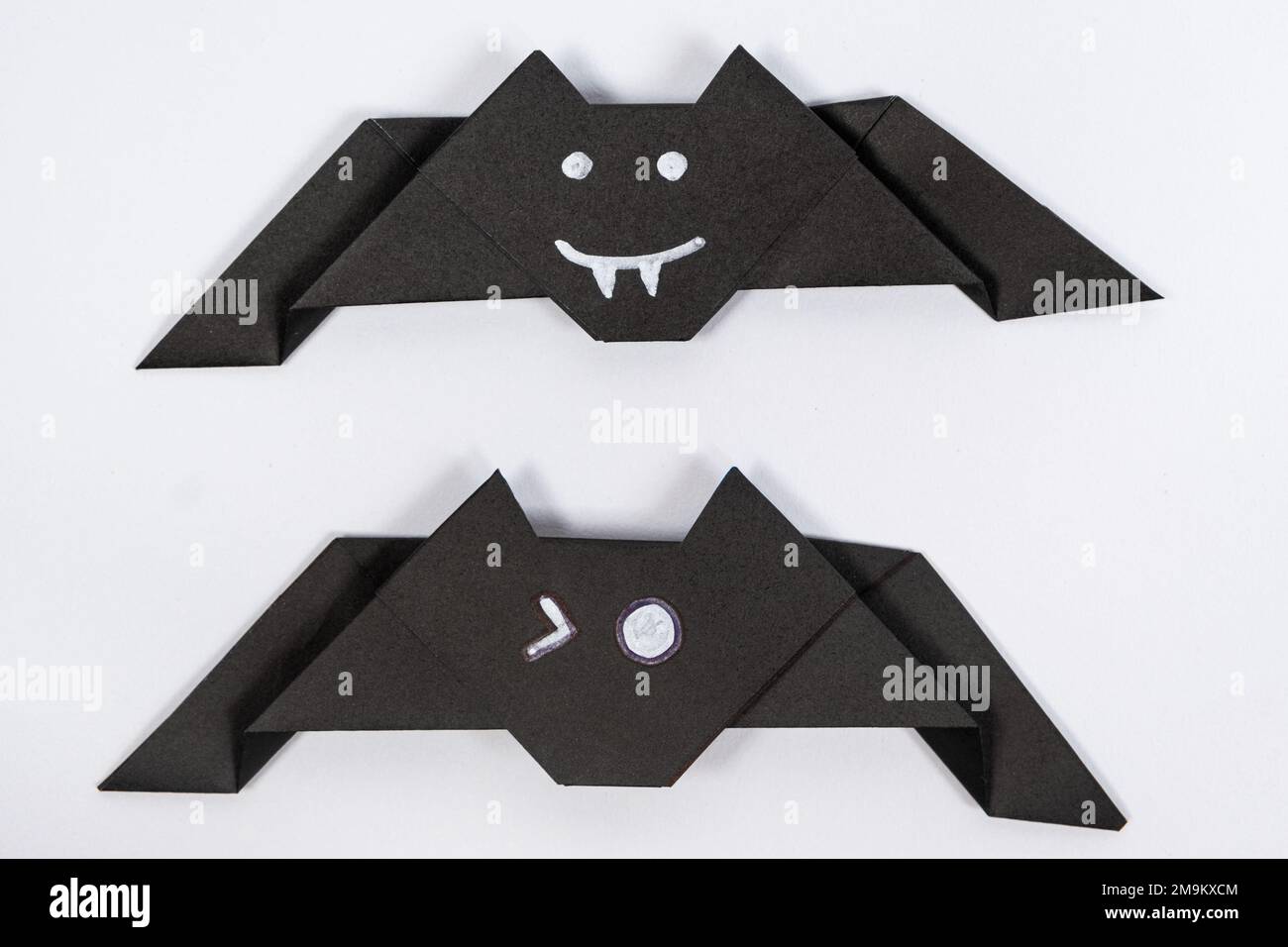 Halloween bats, origami DIY paper crafts on white background, top view ...