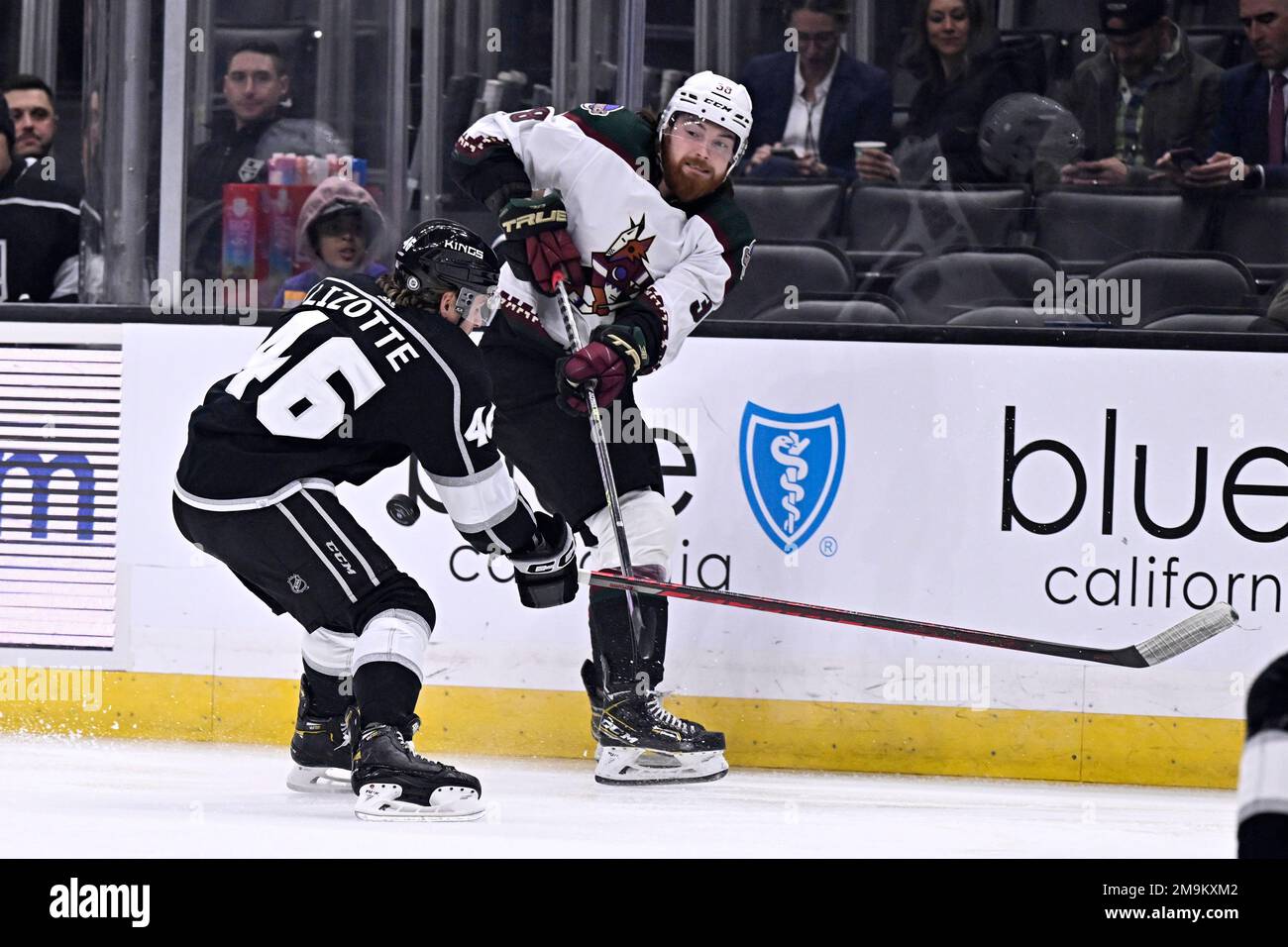 Arizona Coyotes center Liam O'Brien (38) passes the puck past Los ...