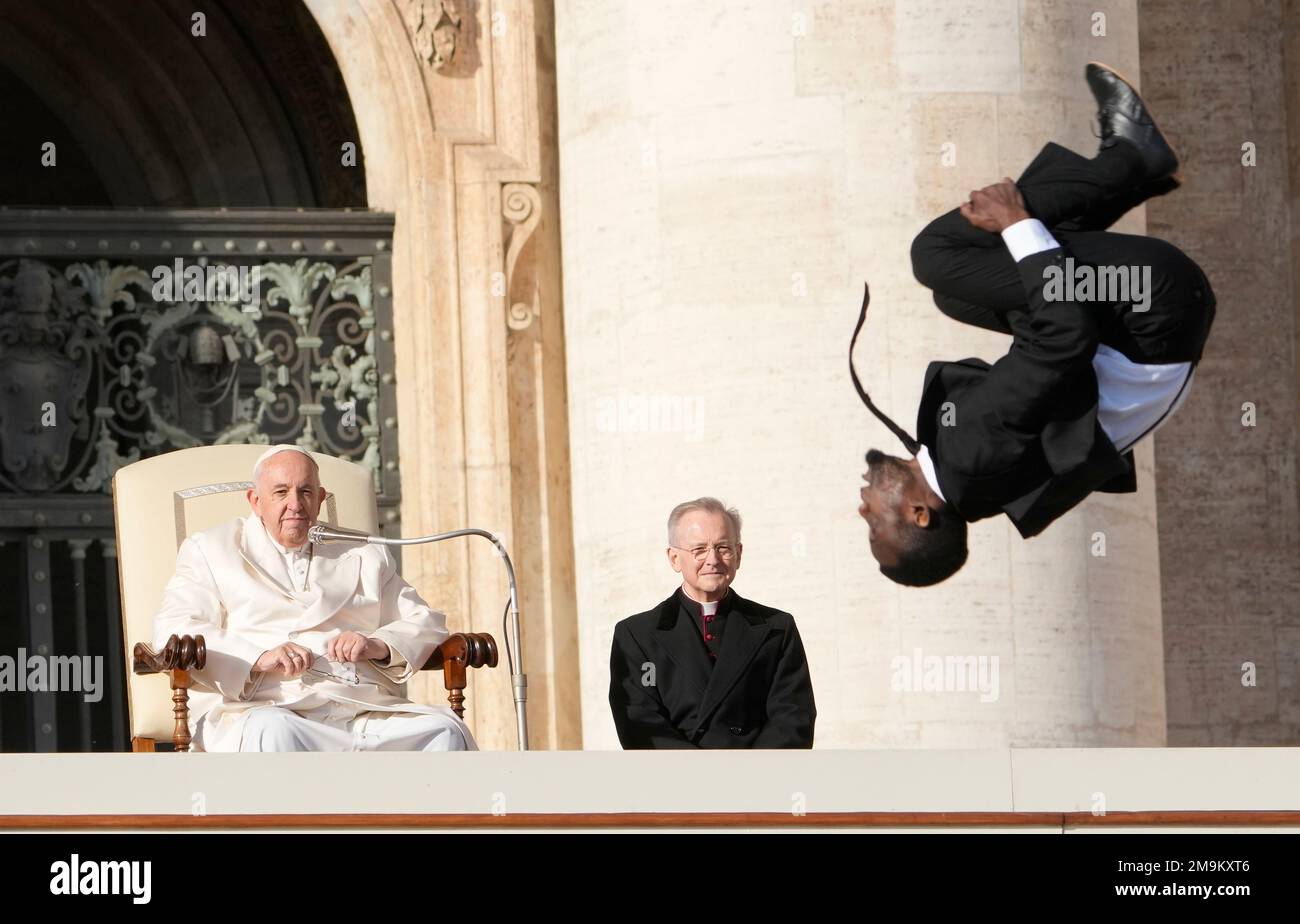 Pope Francis looks at an acrobat of the "Black Blues Brothers ...