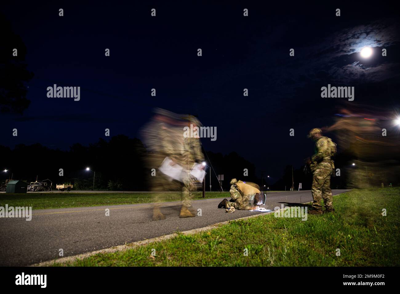 U.S. Army Sgt. Sidney Perry, center left, and Cpl. Trevor Franklin ...