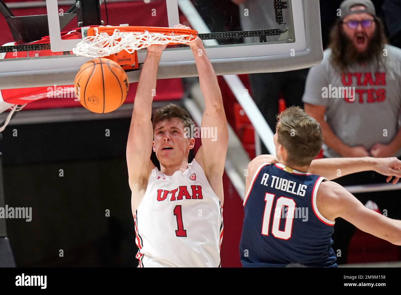 Utah forward Ben Carlson (1) dunks against Arizona forward Azuolas ...