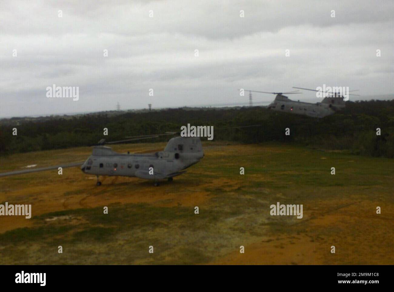 Twp US Marine Corps (USMC) CH-46 Sea Knight Helicopter assigned to ...