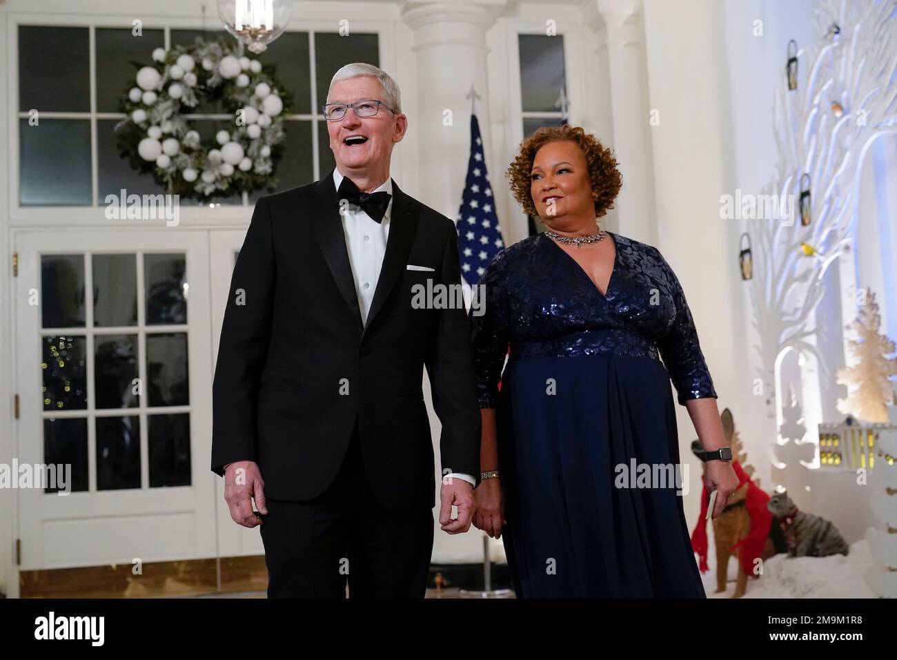 Apple CEO Tim Cook and Lisa Jackson, former administrator of the ...