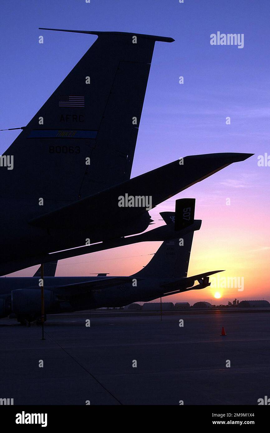 With the sun on the horizon, US Air Force (USAF) KC-135 Stratotanker ...