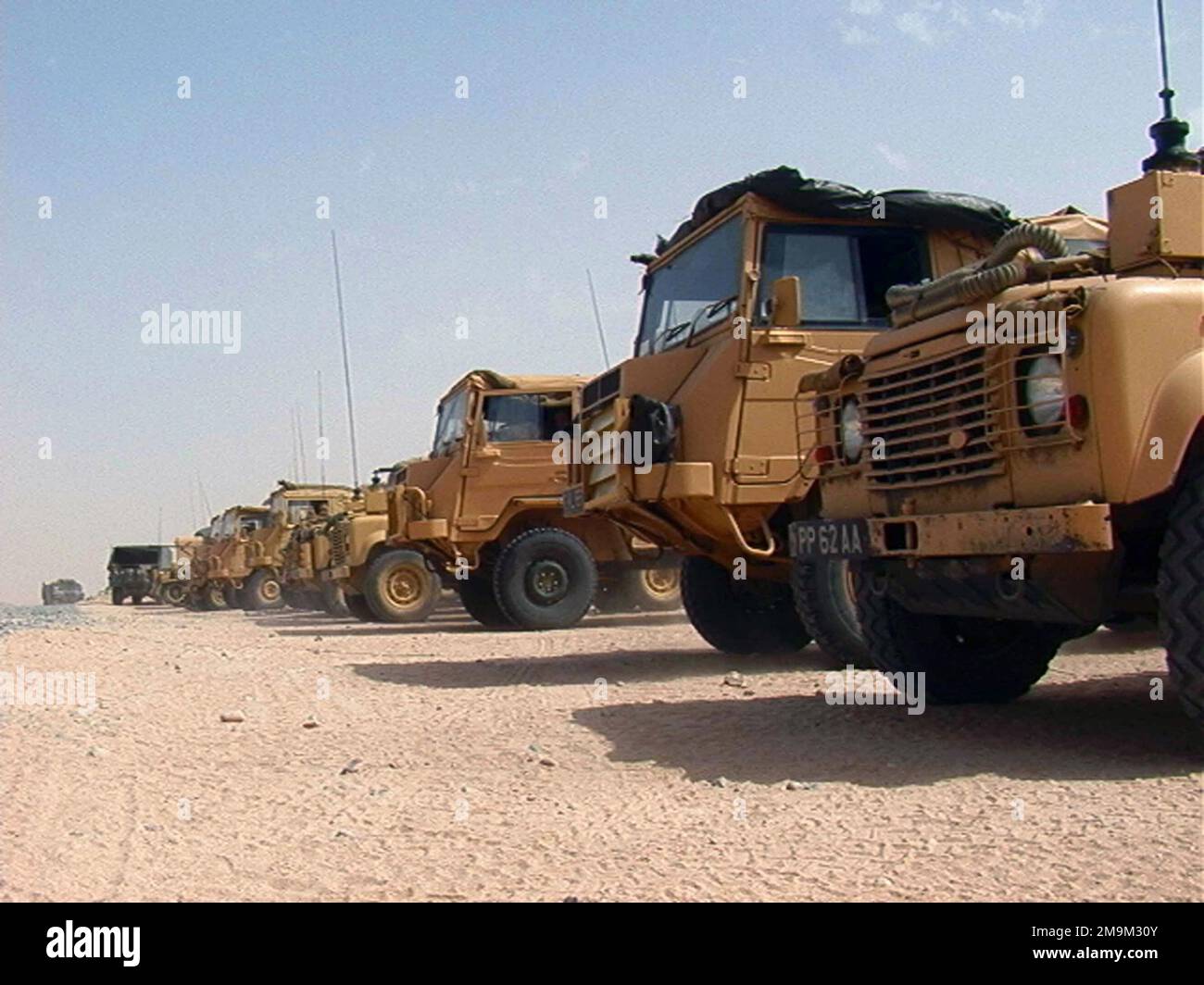 British equipment and vehicles line the road as British forces visit ...