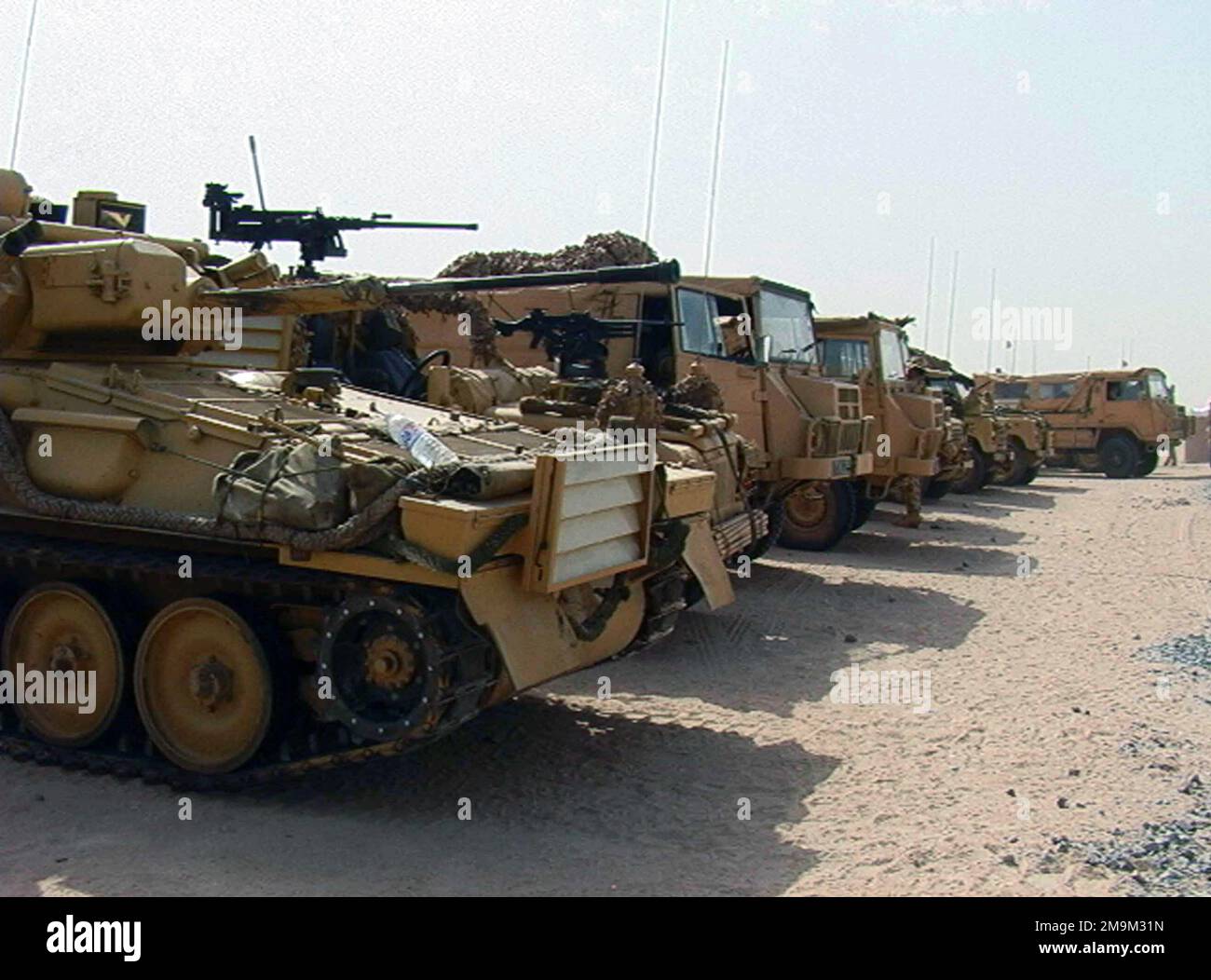 British equipment and vehicles line the road as British forces visit ...