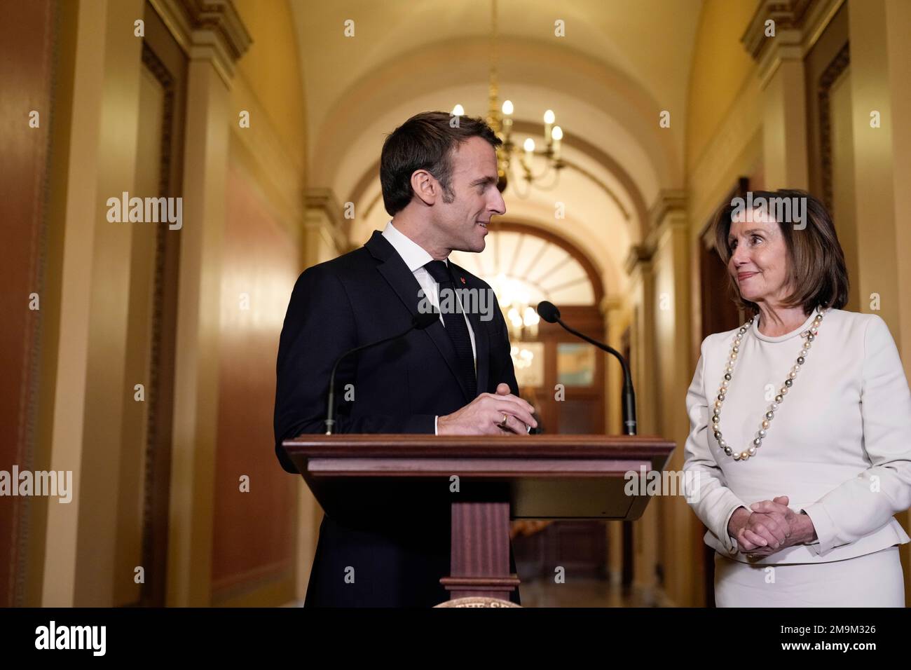 French President Emmanuel Macron speaks as he is welcomed to the U.S ...