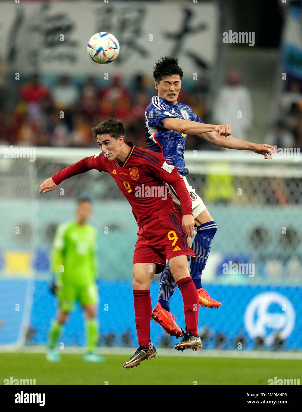 Spain's Gavi (9) and Japan's Shogo Taniguchi battle for a header during ...